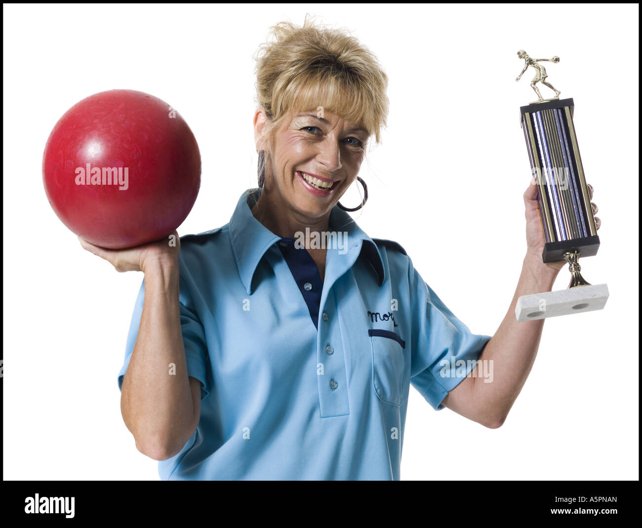Female bowler holding trophy Stock Photo - Alamy