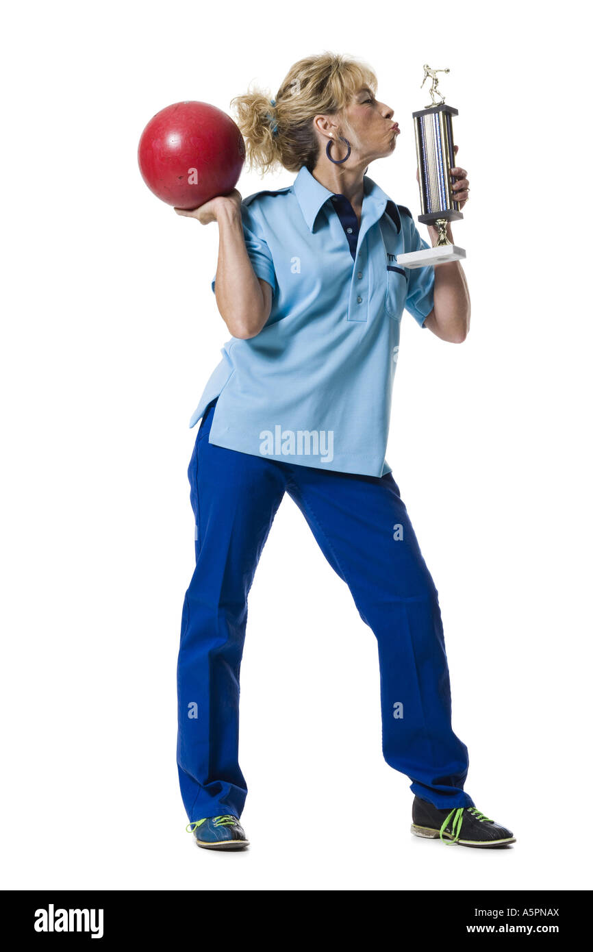 Female bowler holding trophy Stock Photo - Alamy