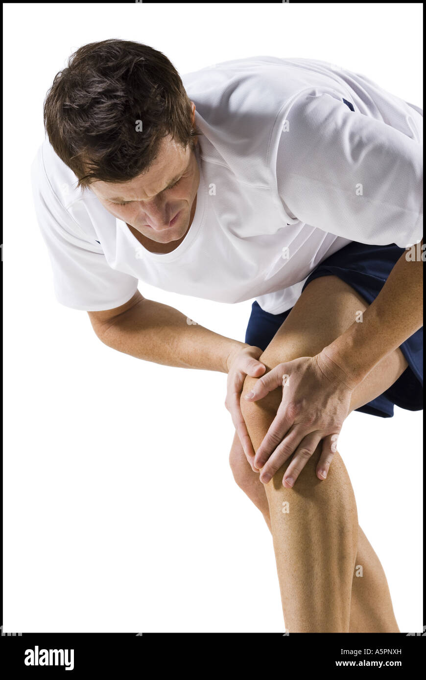 Man wrapping knee in a bandage Stock Photo - Alamy