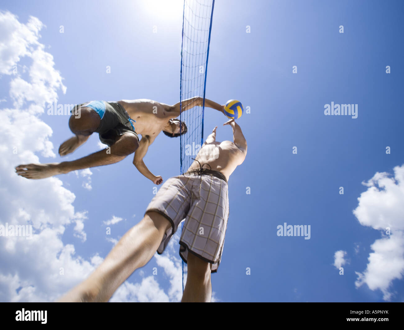 Jumping volleyball players Stock Photo - Alamy