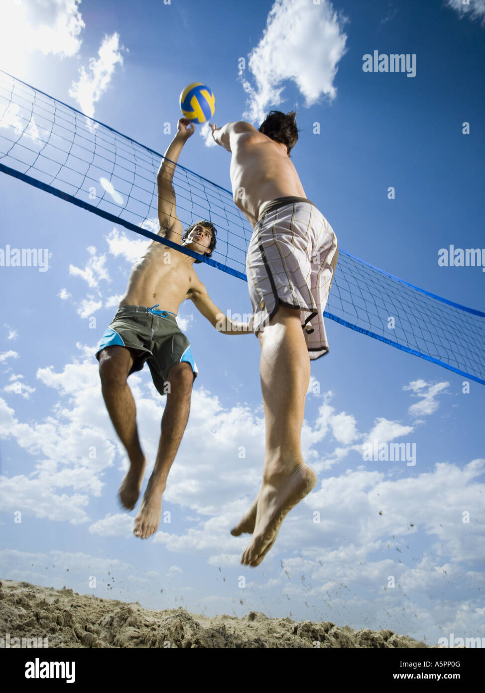 Jumping volleyball players Stock Photo - Alamy