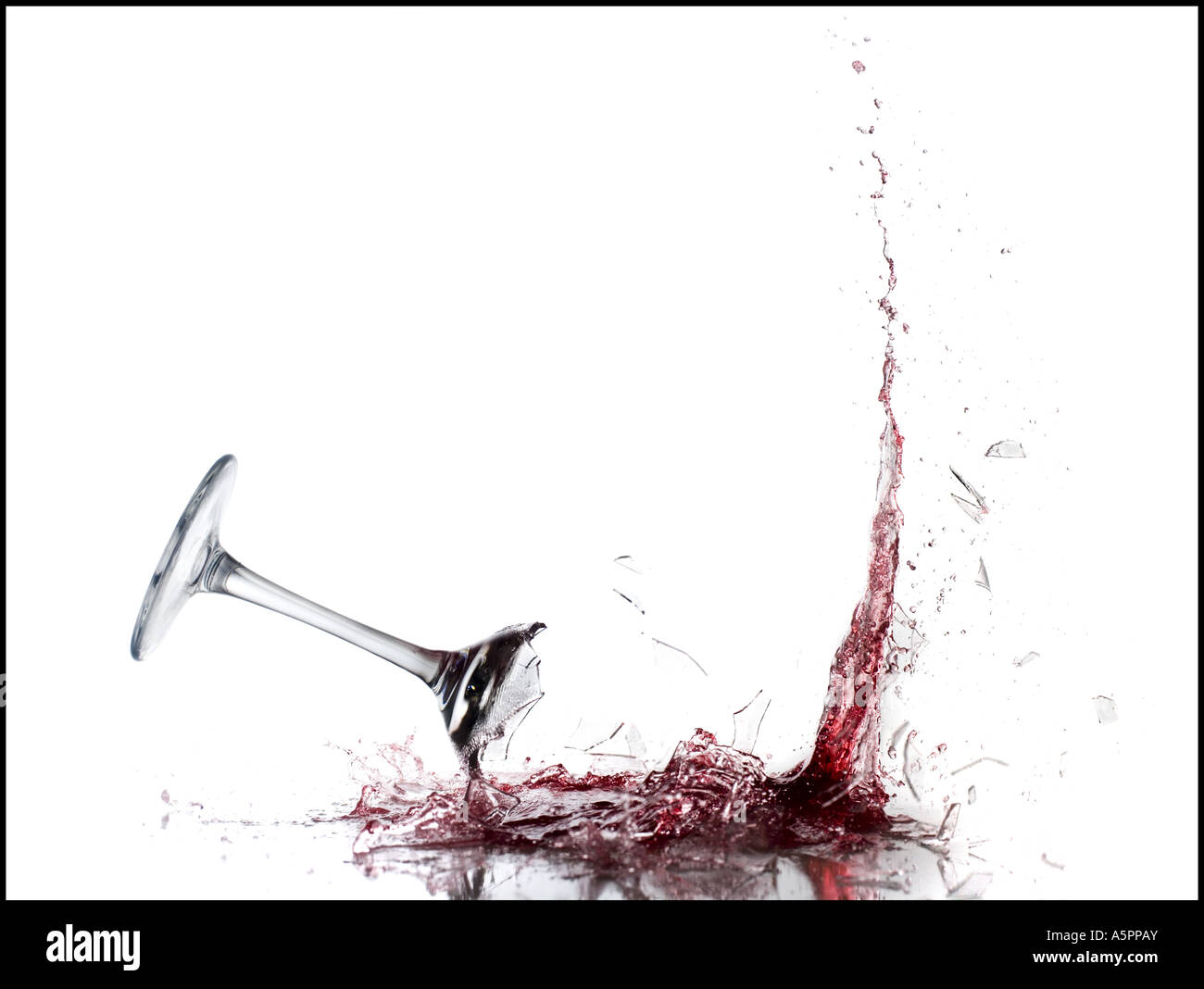 Falling glass of red wine Stock Photo - Alamy