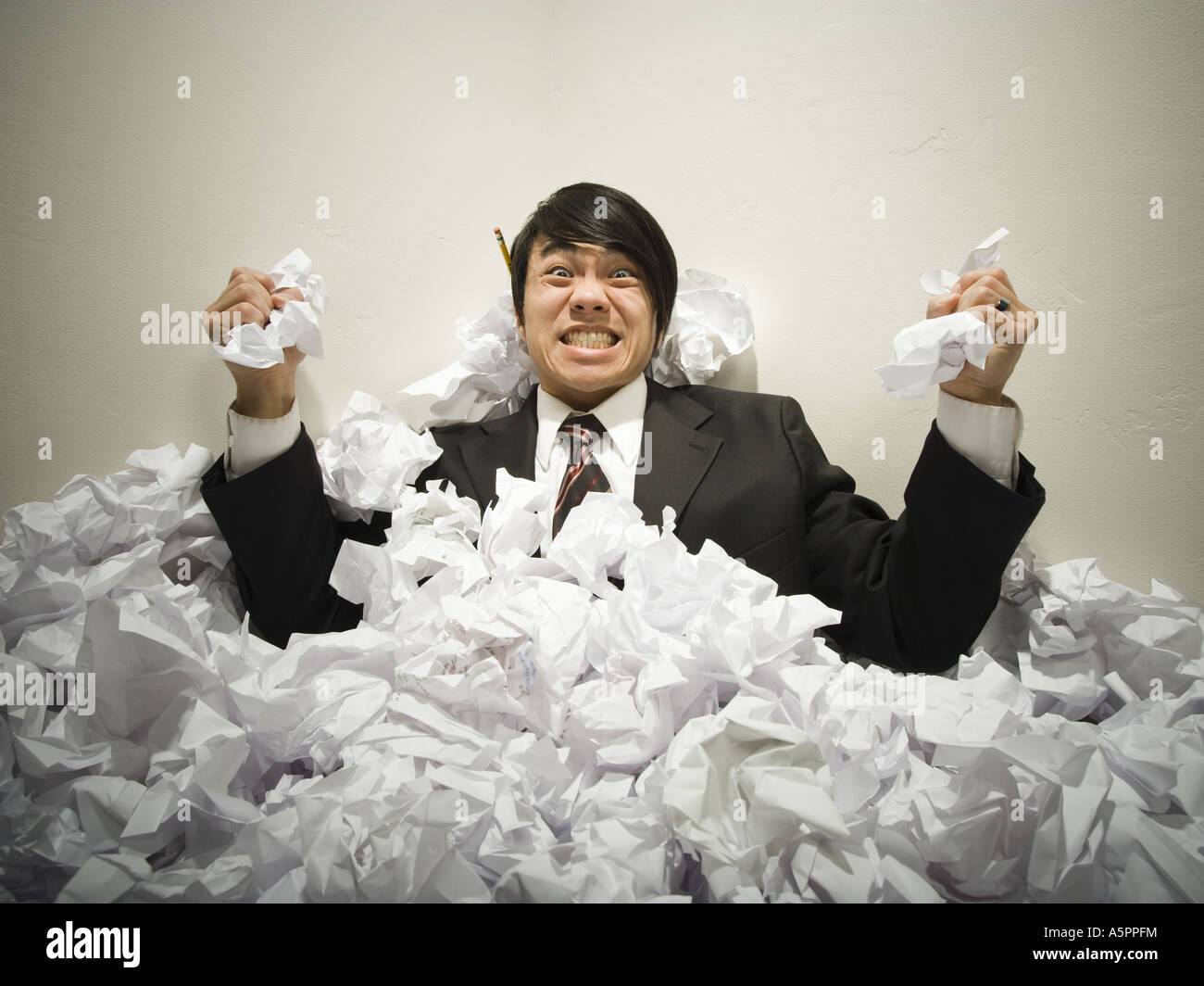 Businessman buried in mountain of crumpled papers Stock Photo - Alamy Businessman buried in mountain of crumpled papers Stock Photo - Alamy