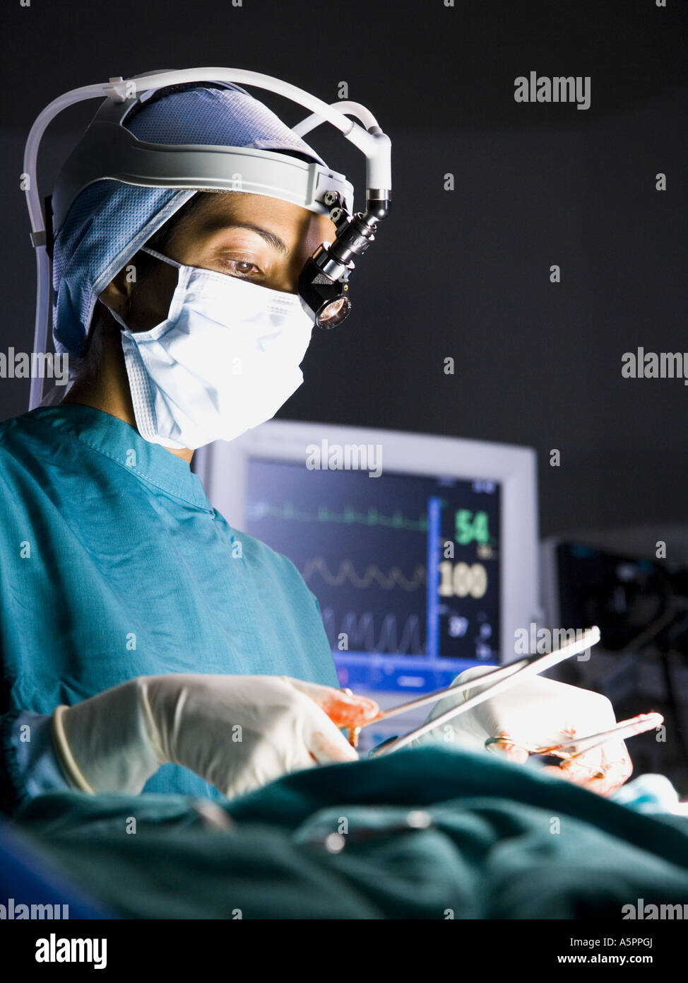 Female surgeon during surgery Stock Photo - Alamy