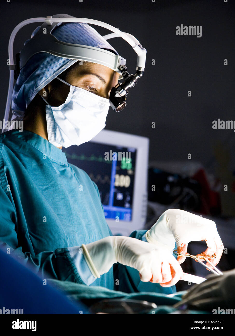 Female surgeon during surgery Stock Photo - Alamy