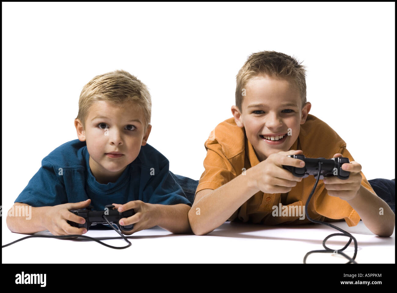 Two brothers playing a video game Stock Photo - Alamy