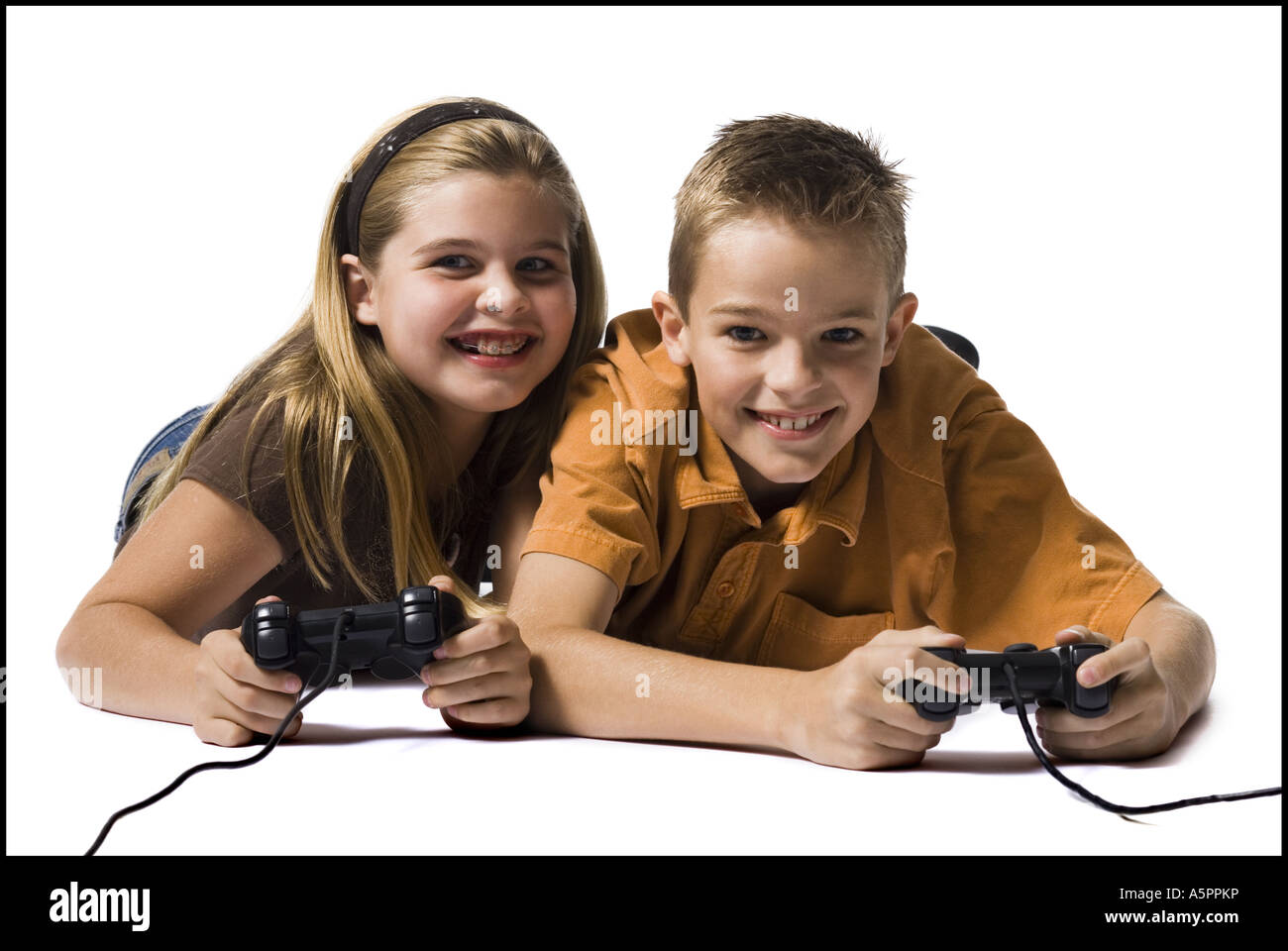 Two brothers playing a video game Stock Photo - Alamy
