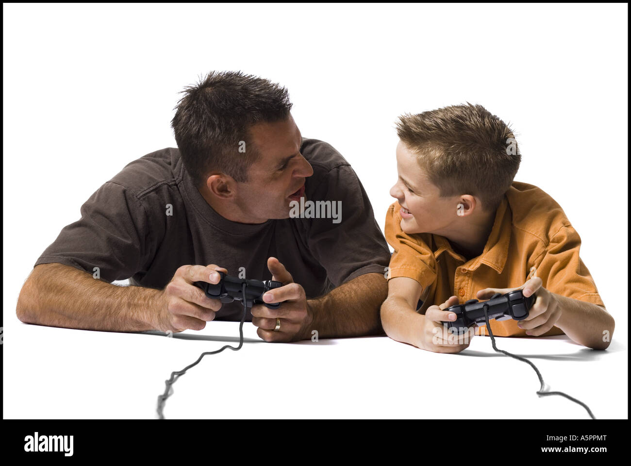 Father and son playing a video game Stock Photo - Alamy