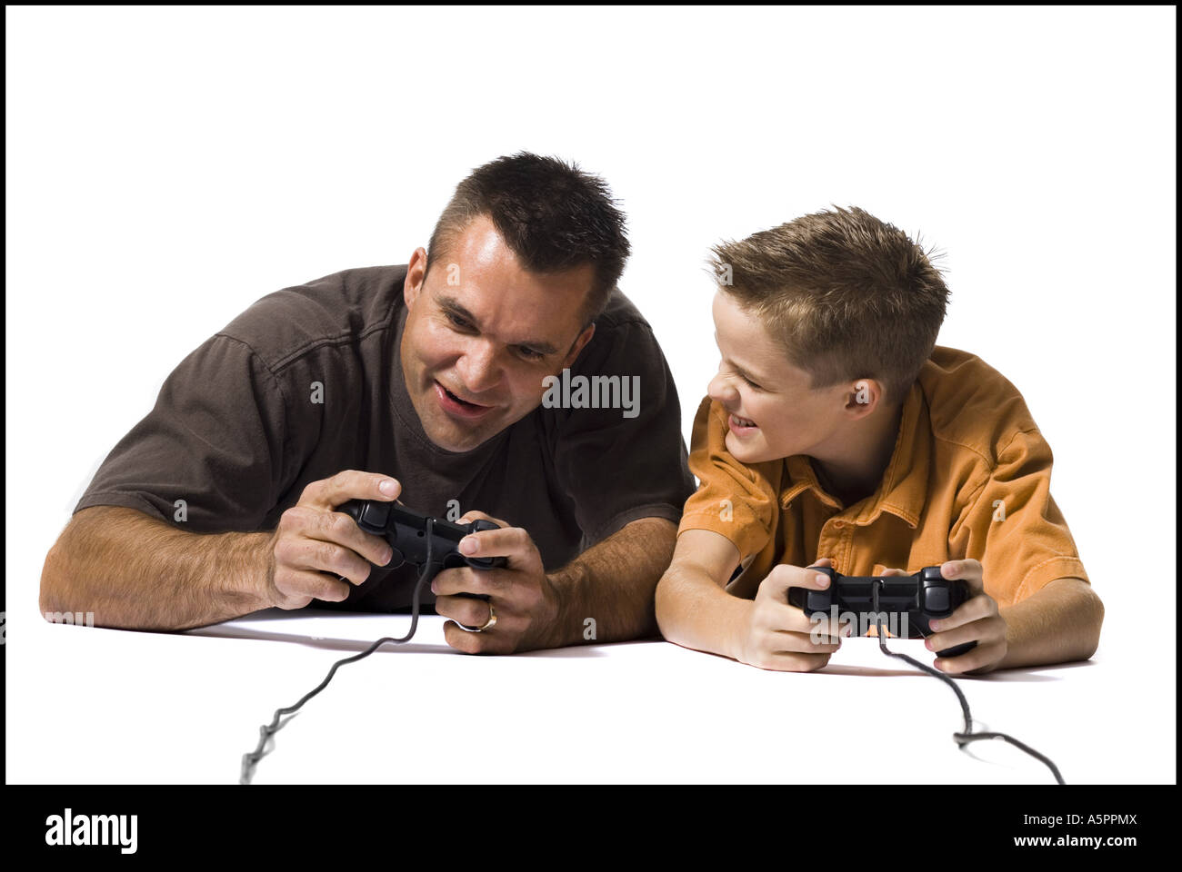Father and son playing a video game Stock Photo - Alamy