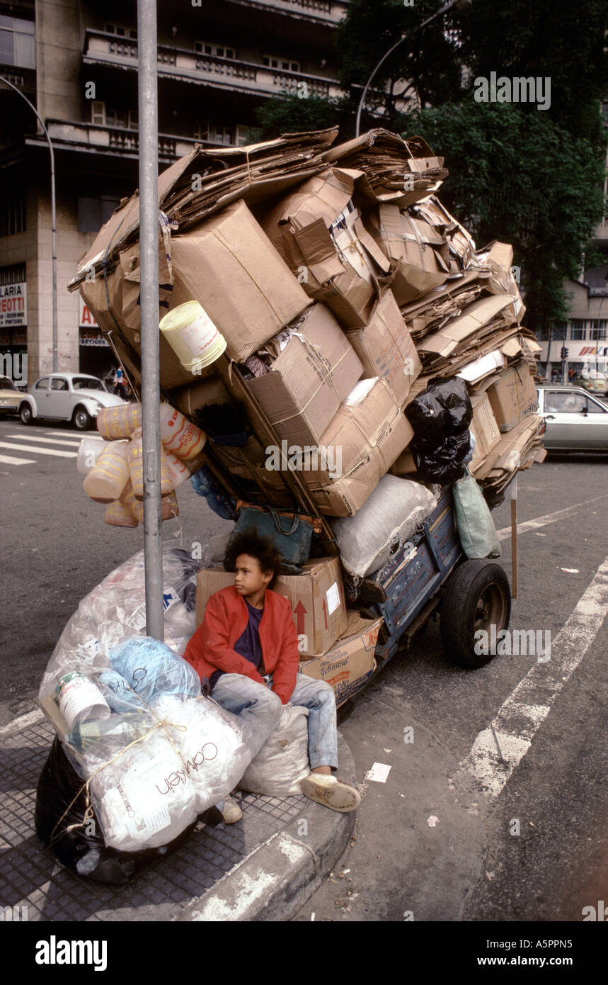 CHILD ON STREET WITH TRAILER OF CARDBOARD BOXES SAO PAULO SHANTY TOWN ...