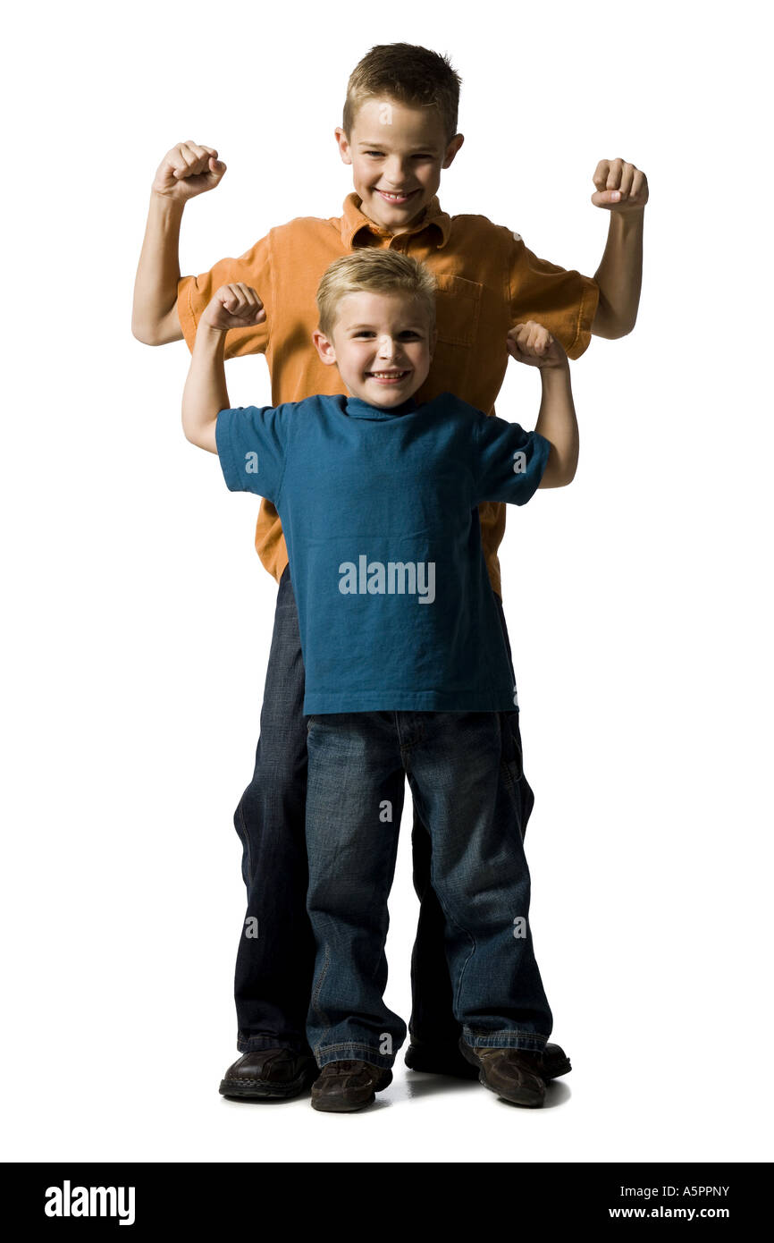 Two brothers posing and flexing muscles Stock Photo - Alamy