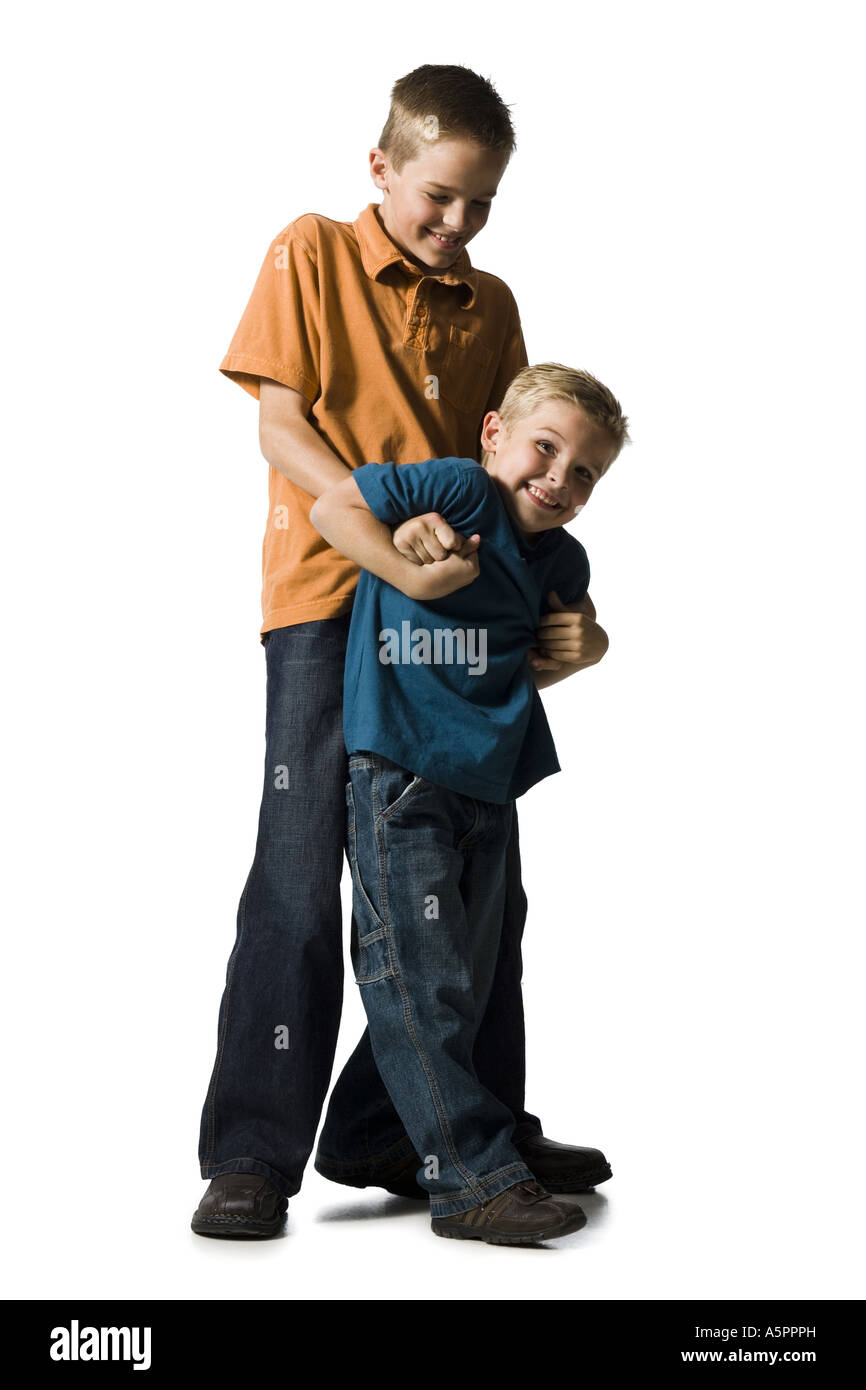Two brothers wrestling and play fighting Stock Photo - Alamy