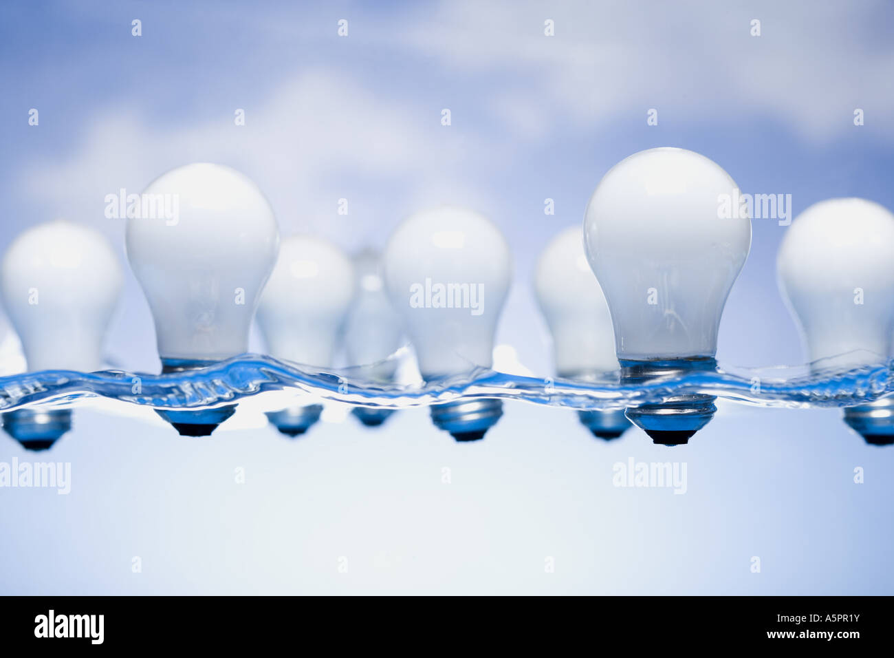 Light bulbs floating in water Stock Photo - Alamy