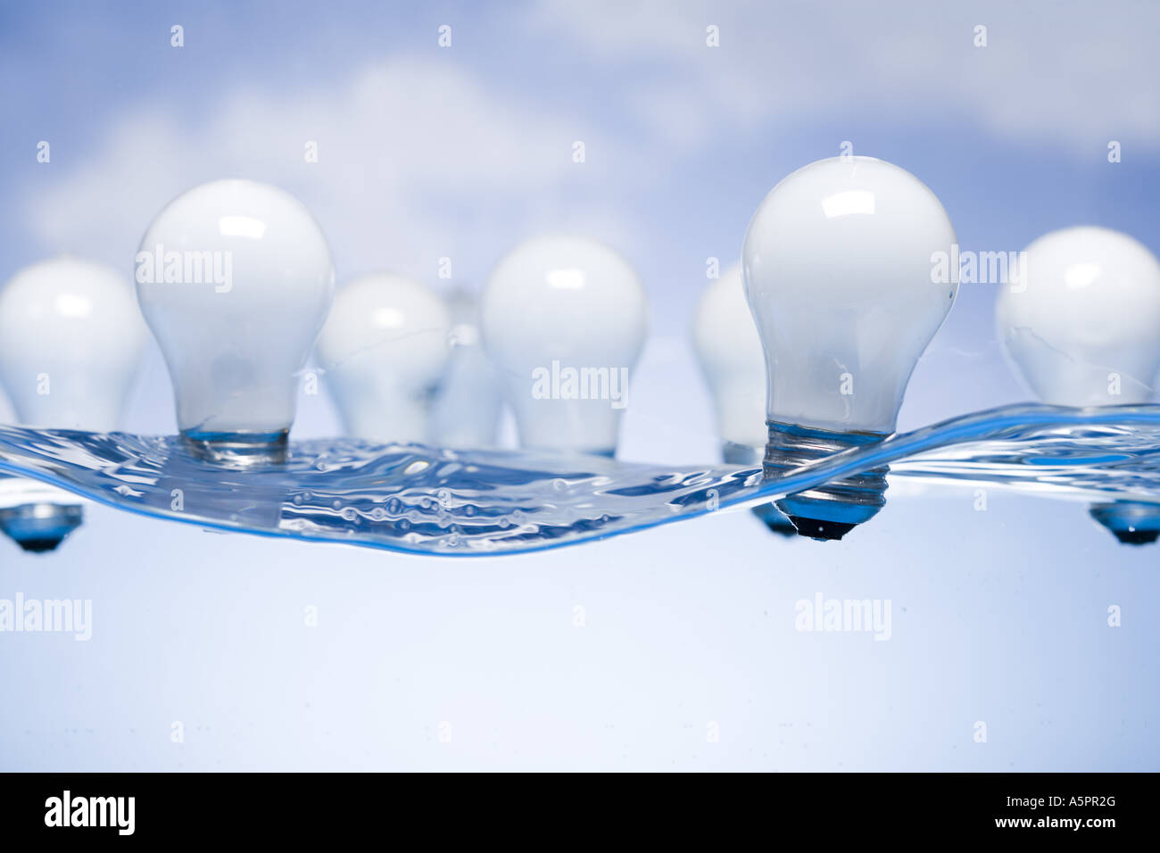 Light bulbs floating in water Stock Photo - Alamy
