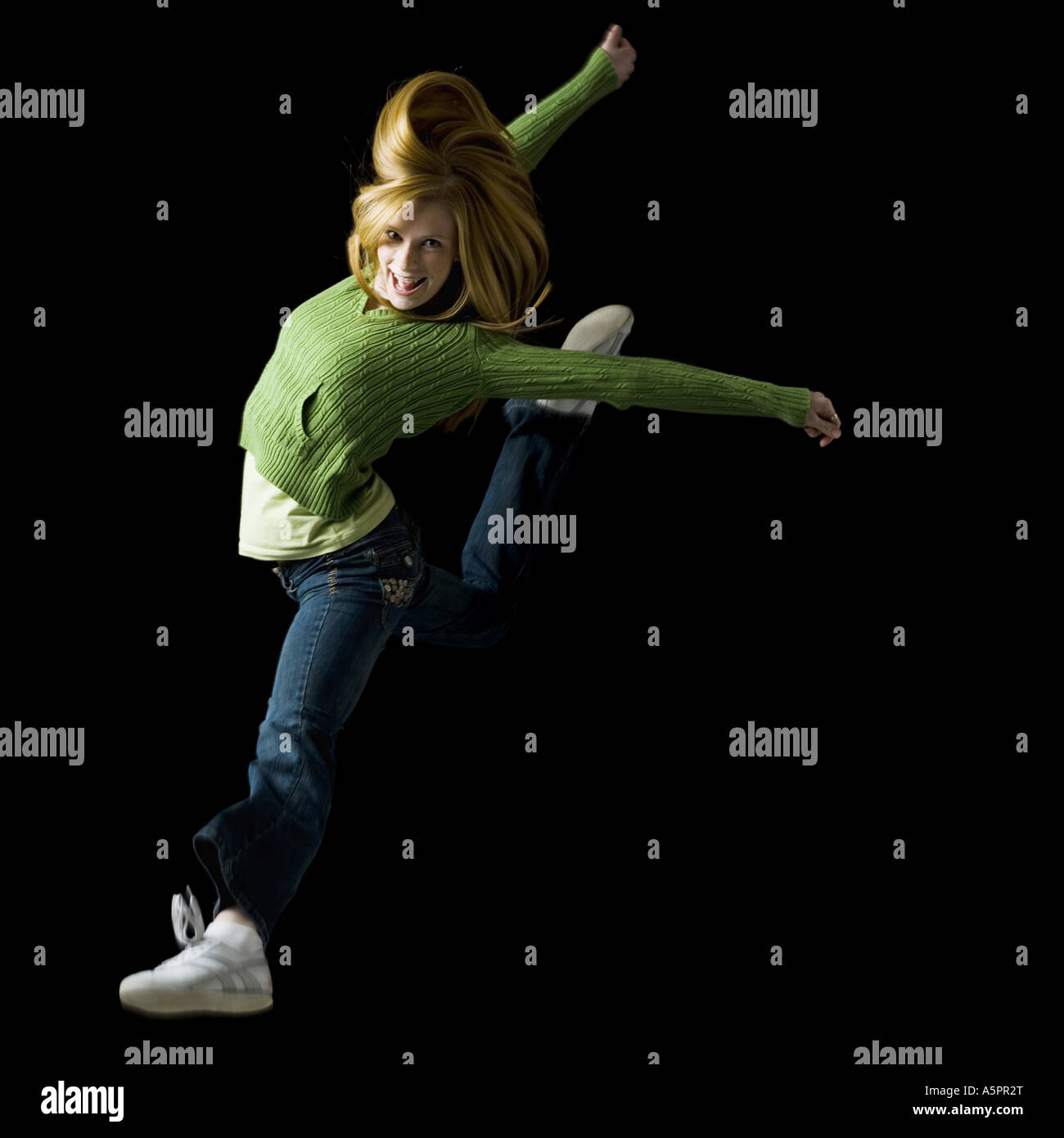 Girl leaping and smiling Stock Photo - Alamy