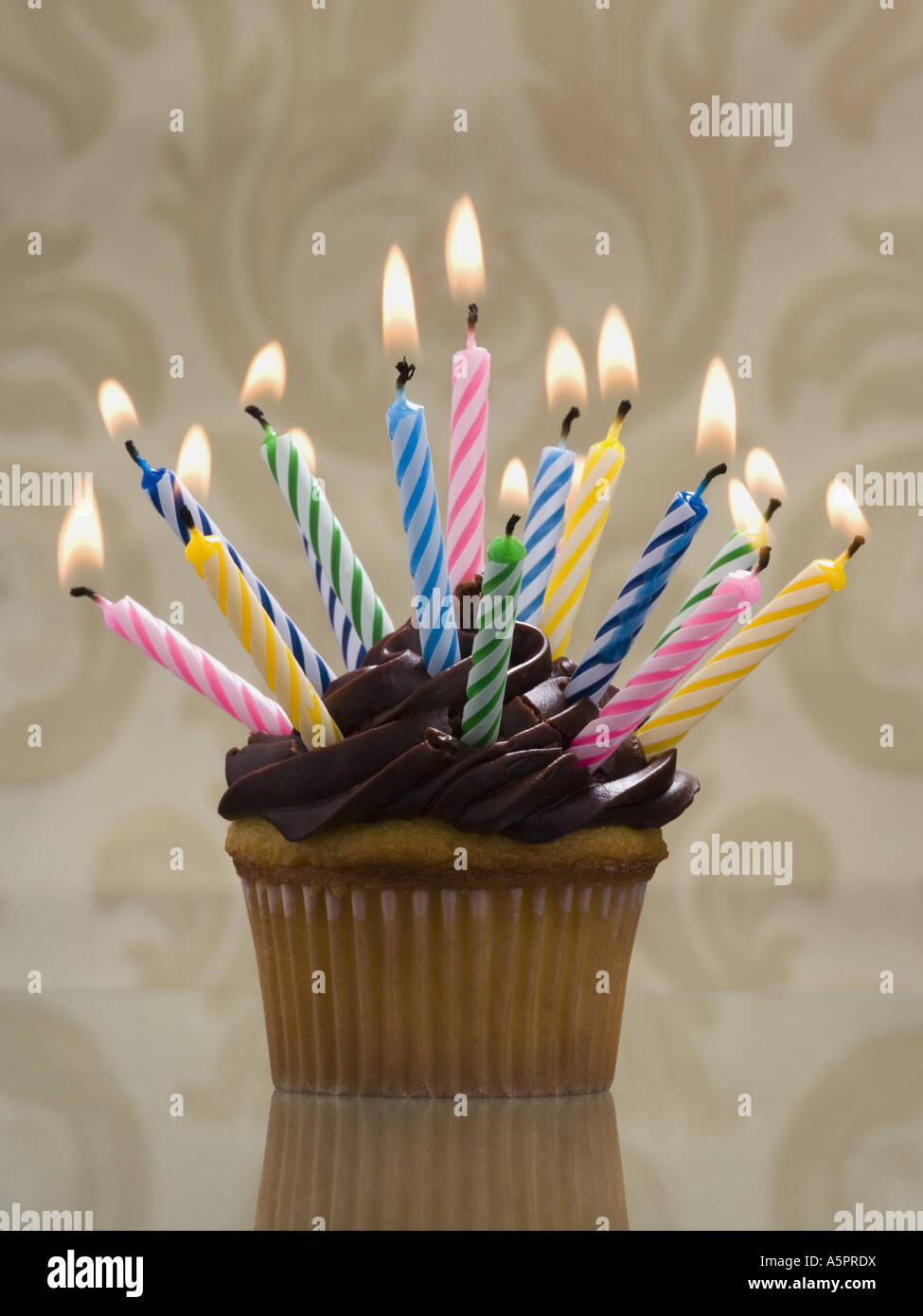 Cupcake with birthday candles Stock Photo - Alamy