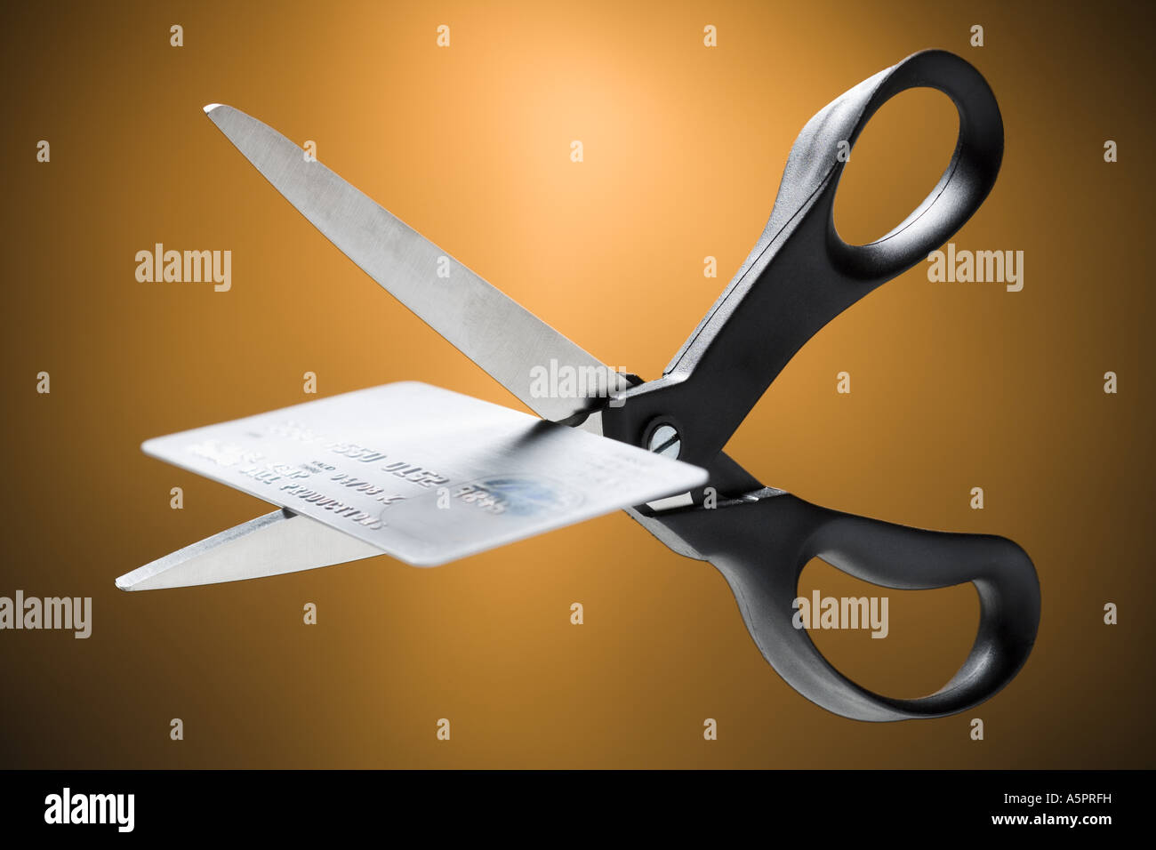 Cutting credit card pair scissors hi-res stock photography and images ...