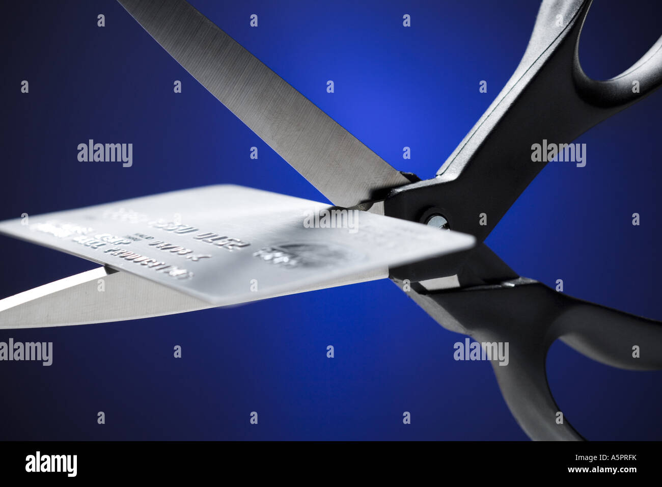 Cutting credit card pair scissors hi-res stock photography and images ...