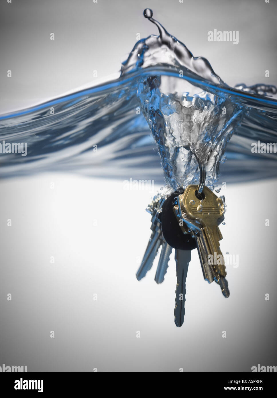 Set of keys dropped in water Stock Photo - Alamy