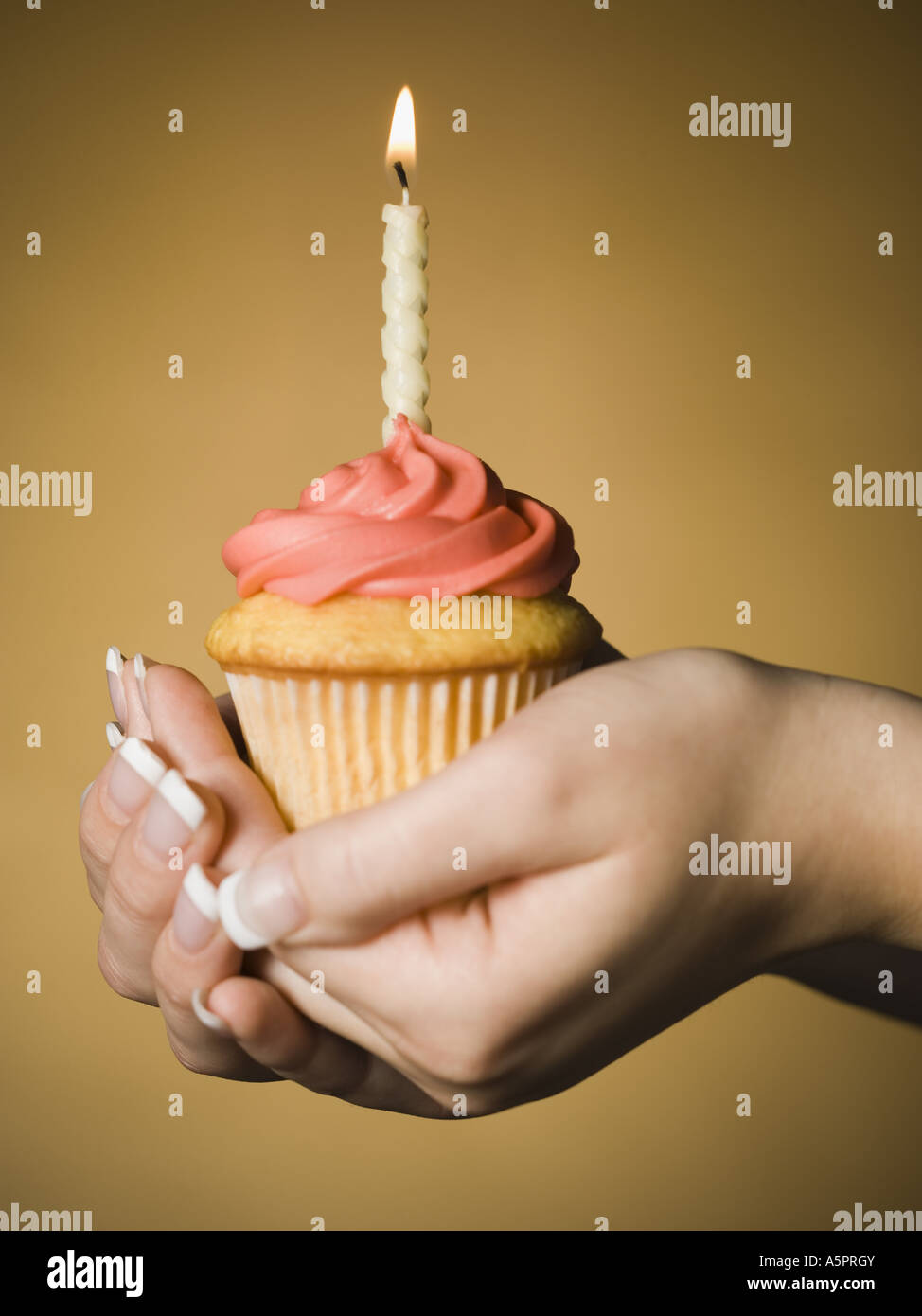 Hands holding cupcake one birthday hi-res stock photography and images ...