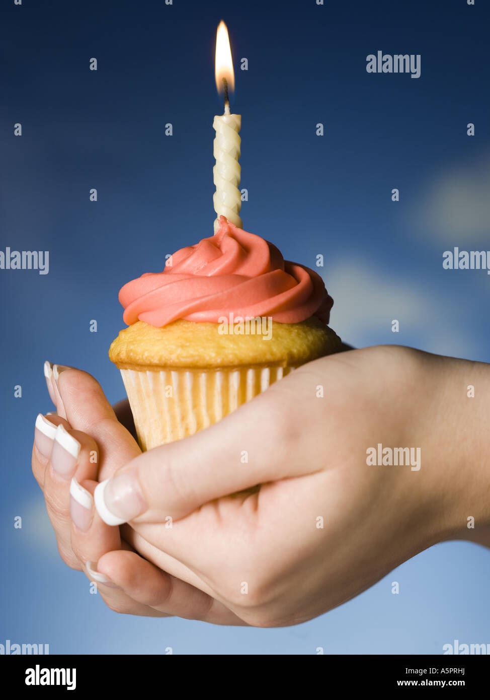 Hands holding cupcake one birthday hi-res stock photography and images ...