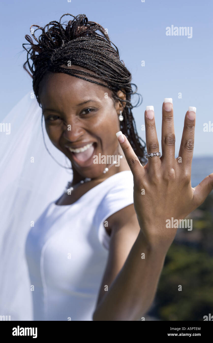 Portrait of a bride showing her wedding ring and smiling Stock Photo ...