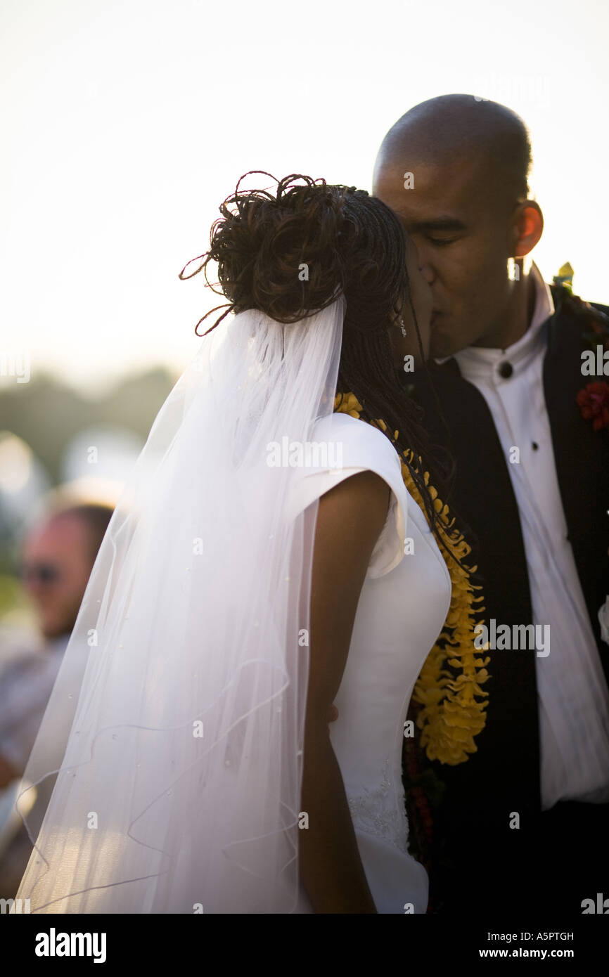 Close-up of a bride and groom kissing Stock Photo - Alamy