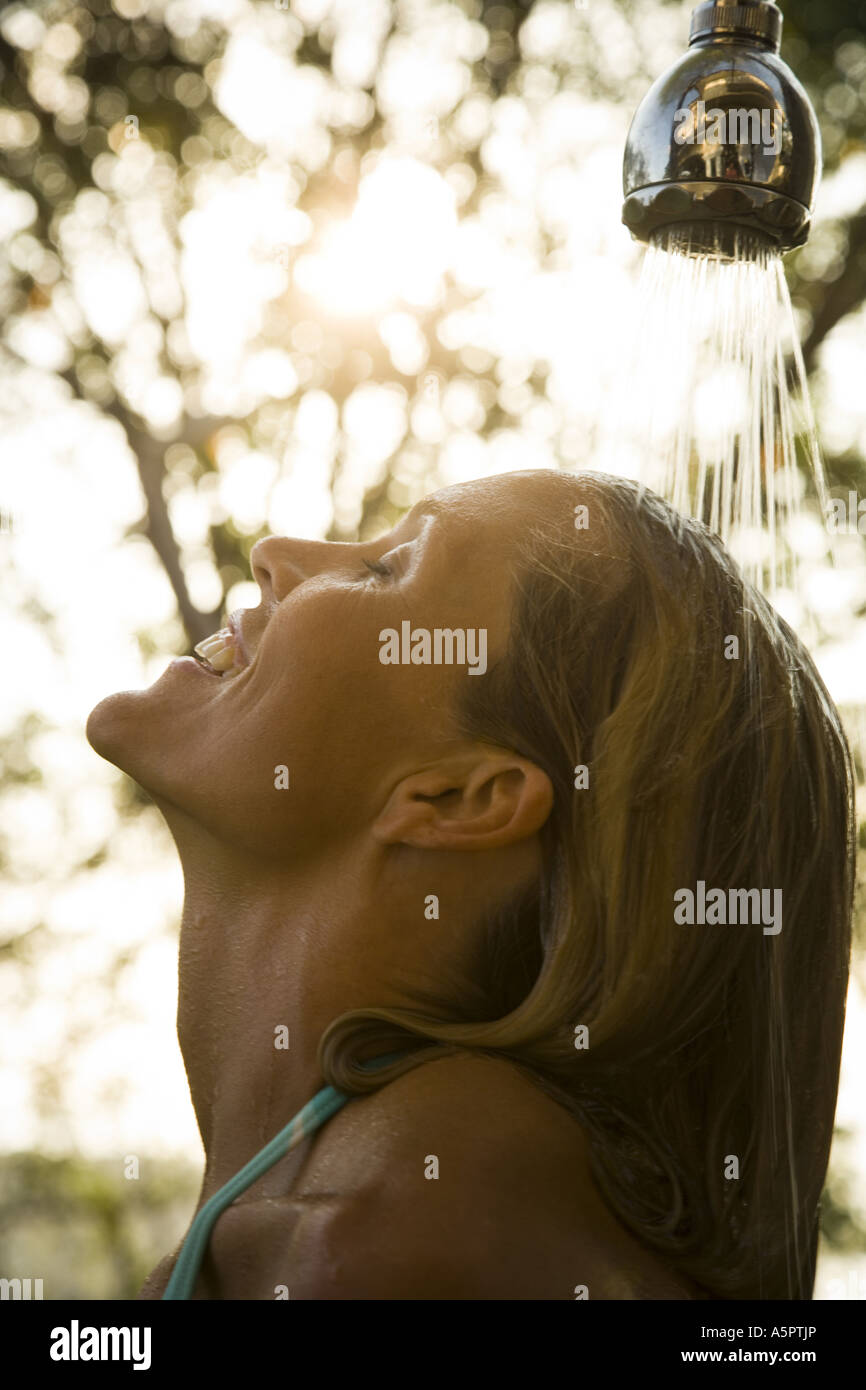 Woman showering outside hi-res stock photography and images - Alamy