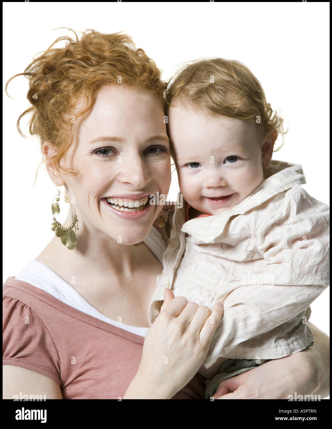 Portrait of a young woman carrying her baby girl Stock Photo - Alamy