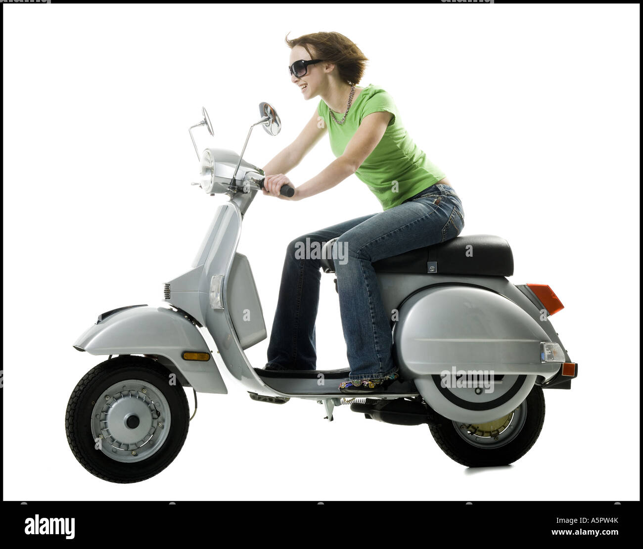 Profile of a teenage girl riding on a scooter Stock Photo - Alamy