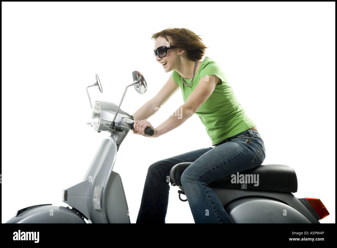 Profile of a teenage girl riding on a scooter Stock Photo - Alamy