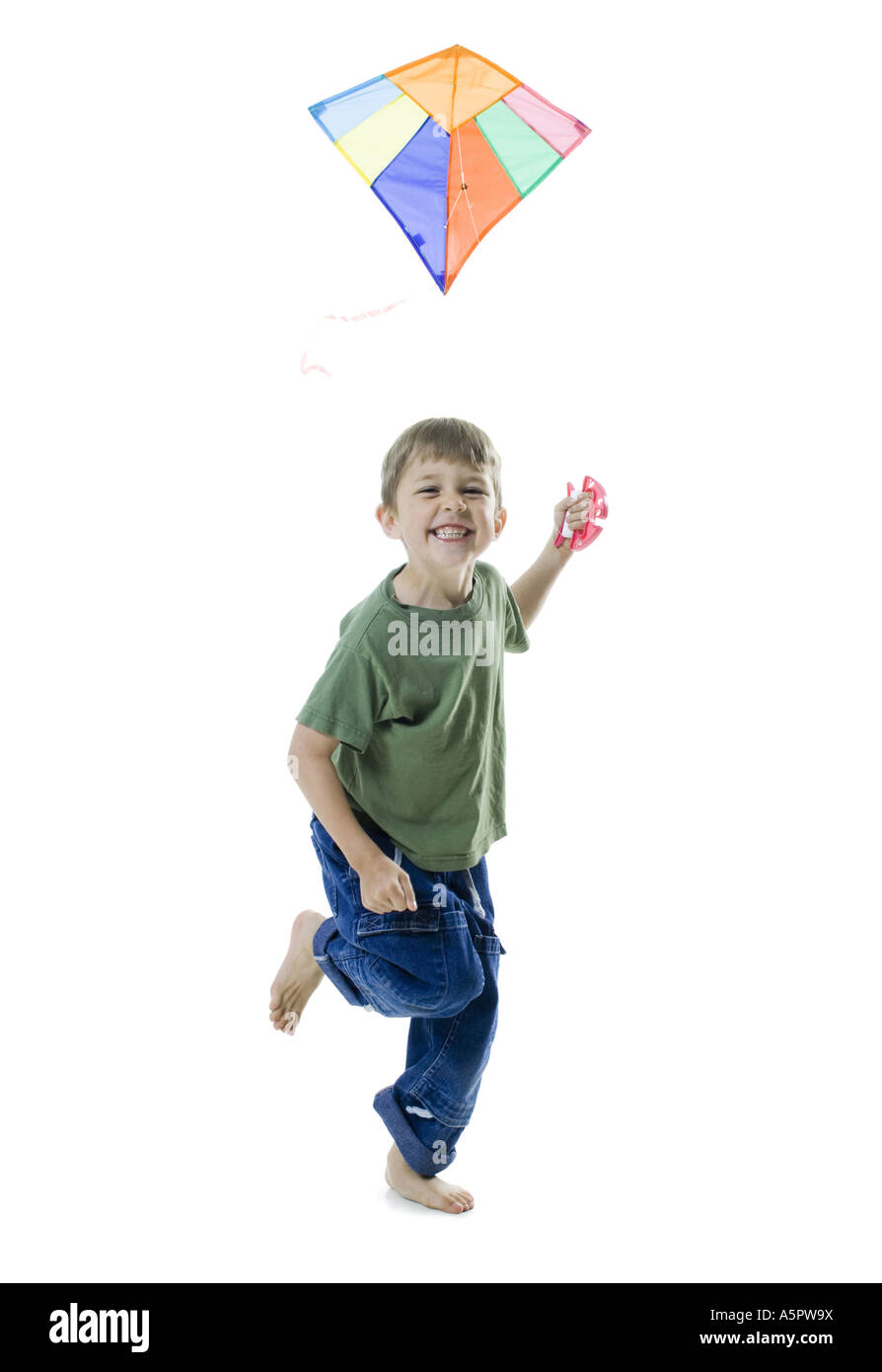 Boy flying a kite Cut Out Stock Images & Pictures - Alamy