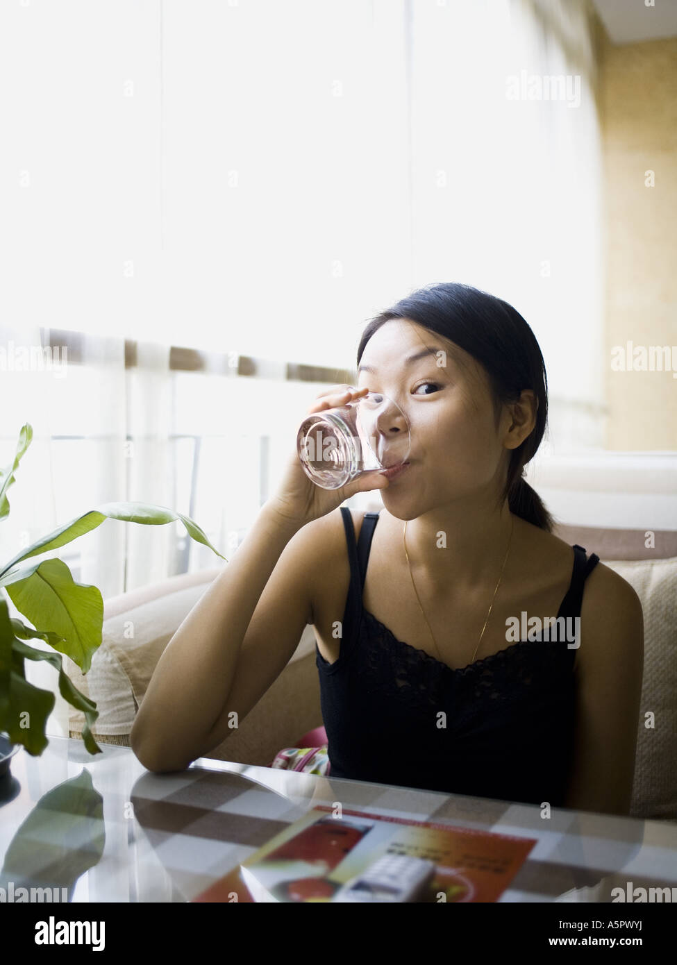 Woman eating at a Chinese food restaurant Stock Photo - Alamy