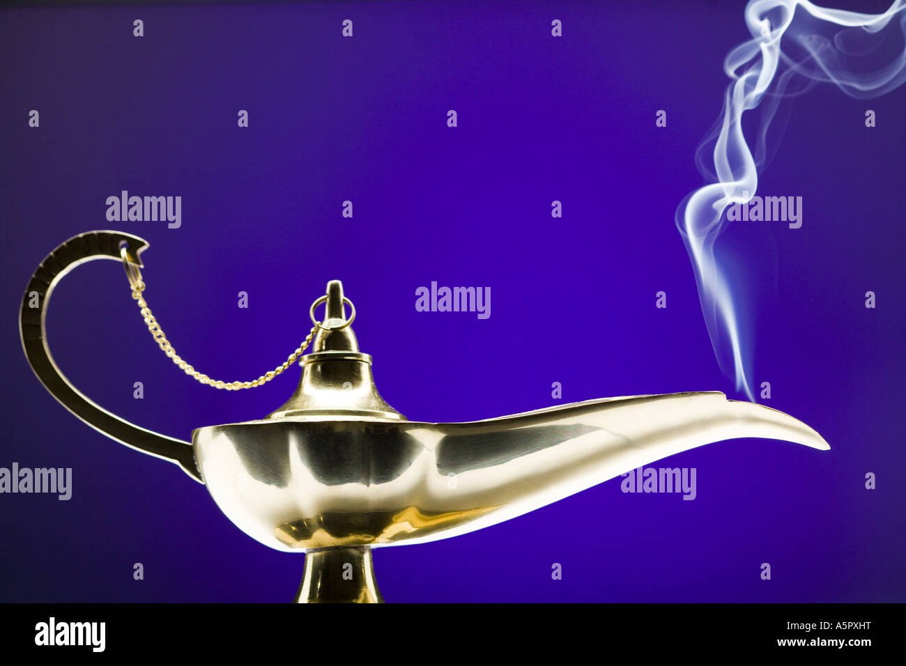 Close up of a magic lamp emitting smoke Stock Photo - Alamy