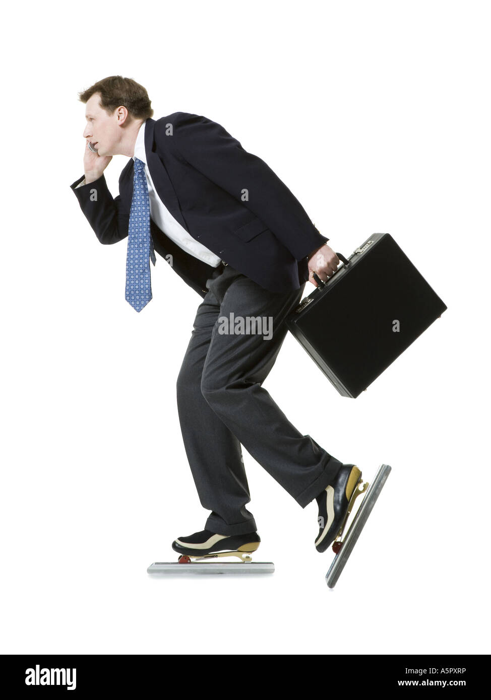 Profile of a businessman ice skating Stock Photo - Alamy