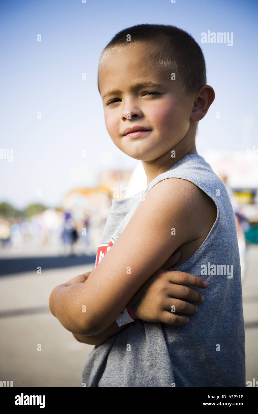 Boy with crossed arms Stock Photo - Alamy