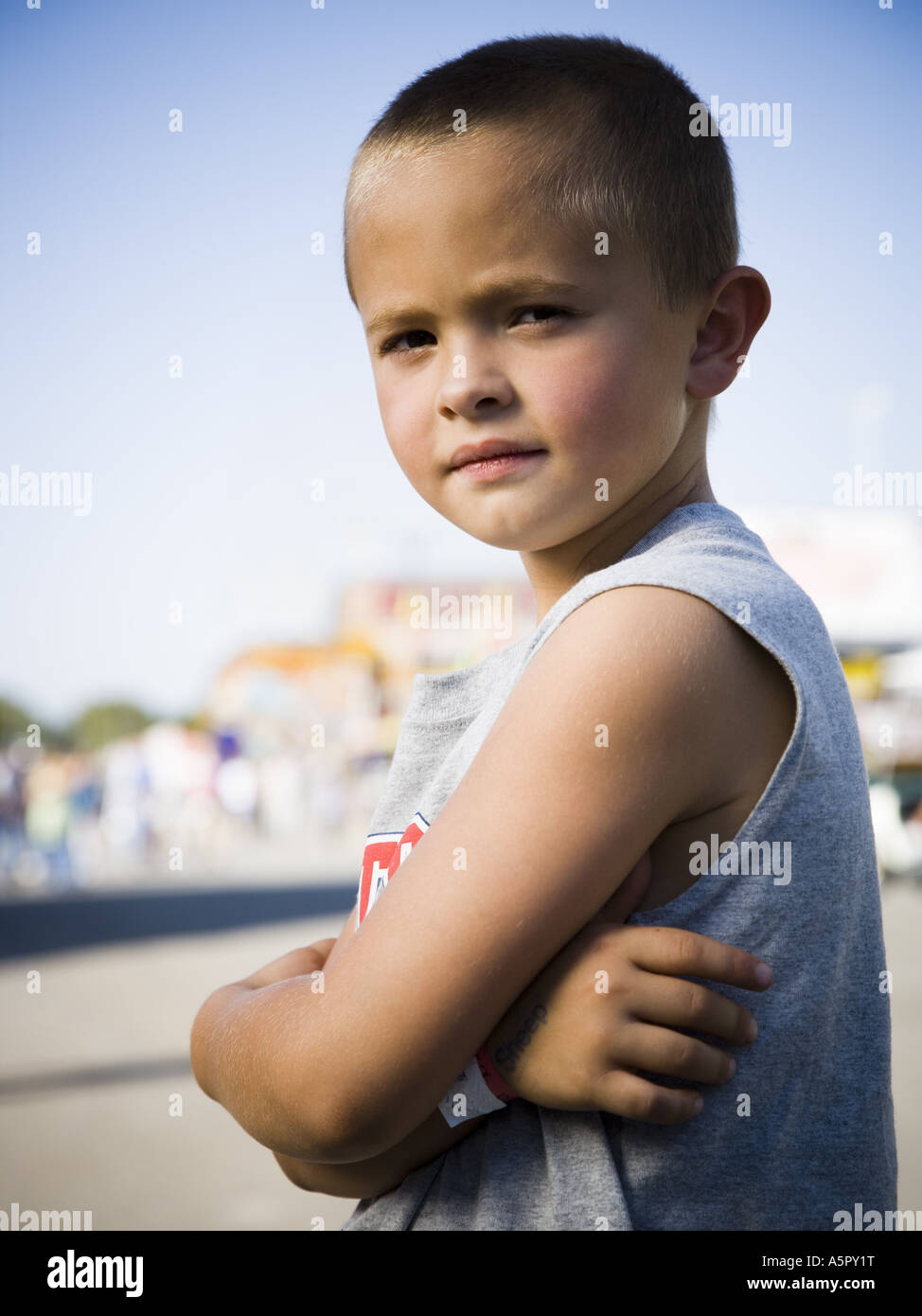 Boy with crossed arms Stock Photo - Alamy