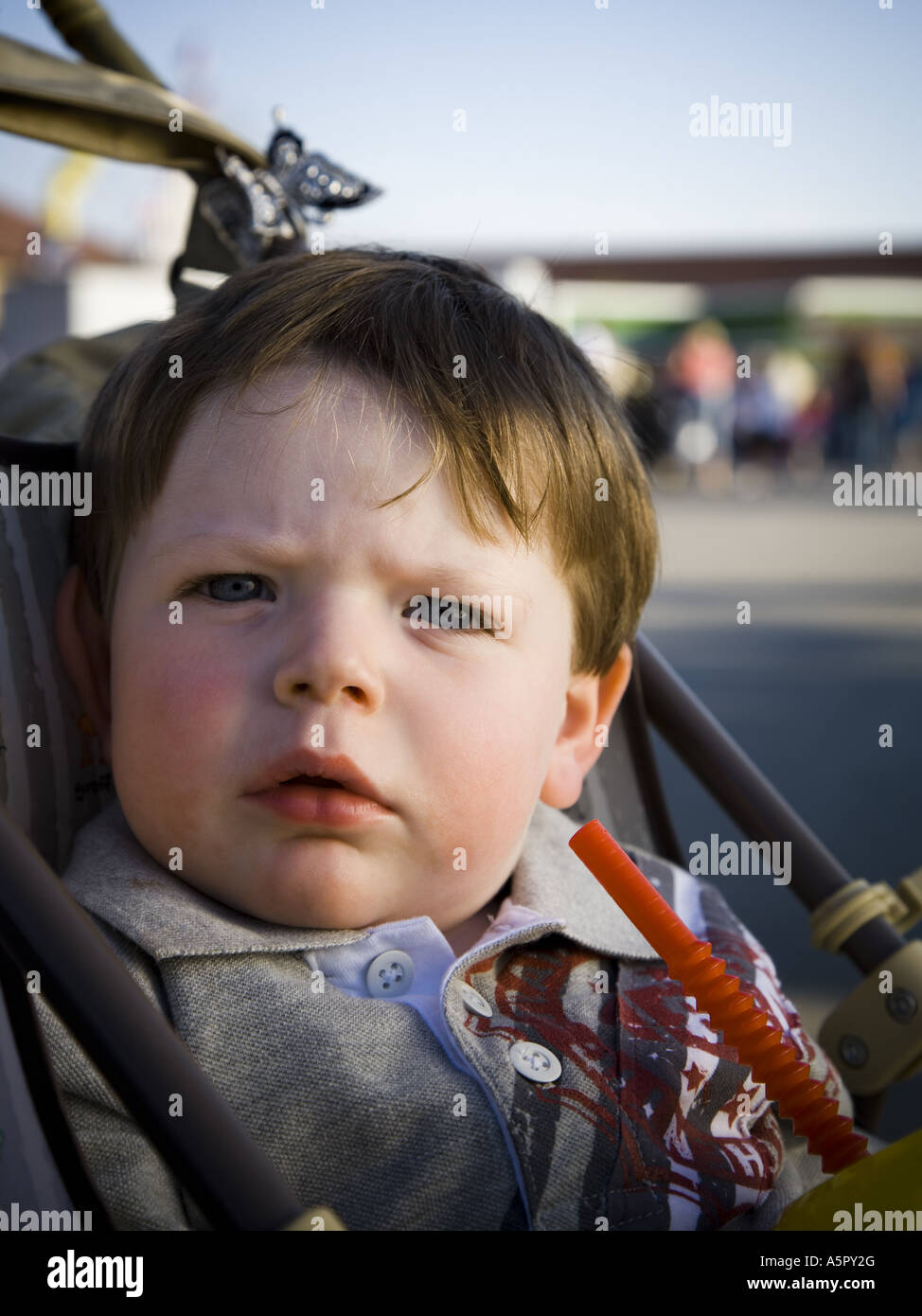 young boy in stroller Stock Photo - Alamy