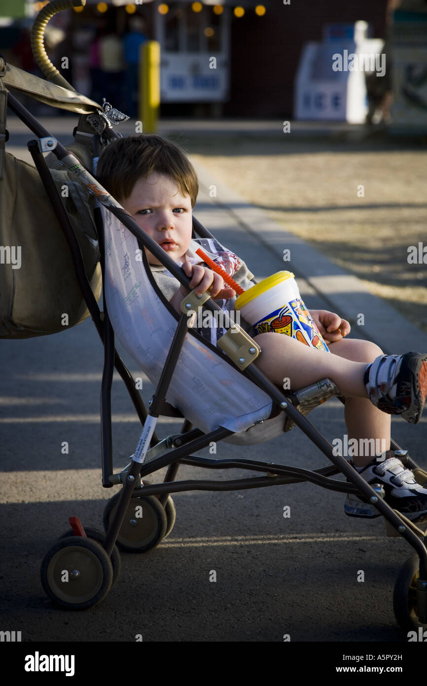 young boy in stroller Stock Photo - Alamy