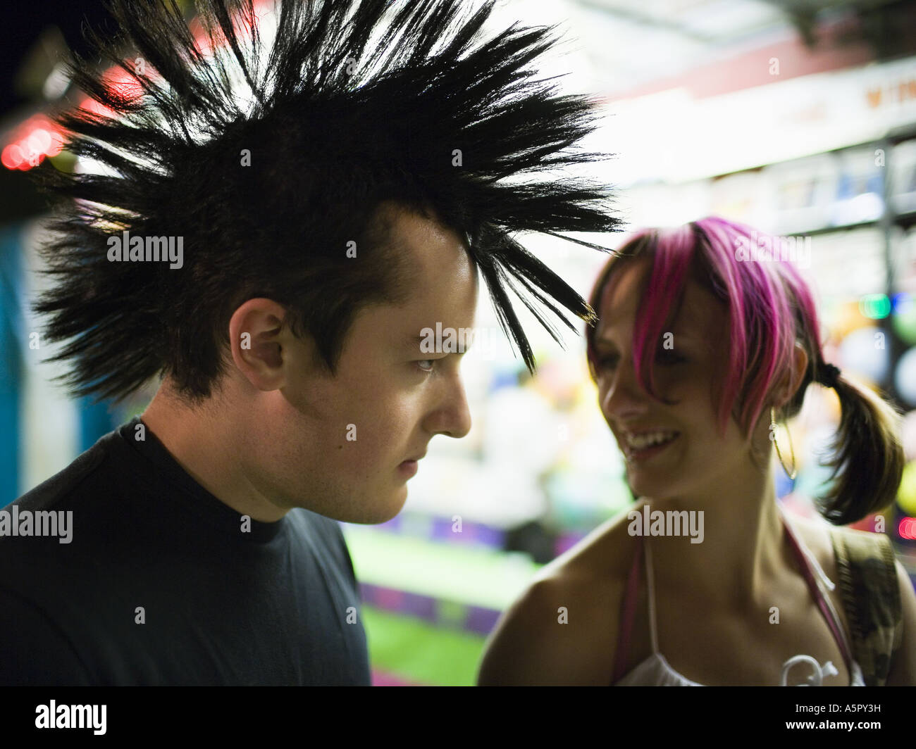 Punk couple at a fairground Stock Photo - Alamy