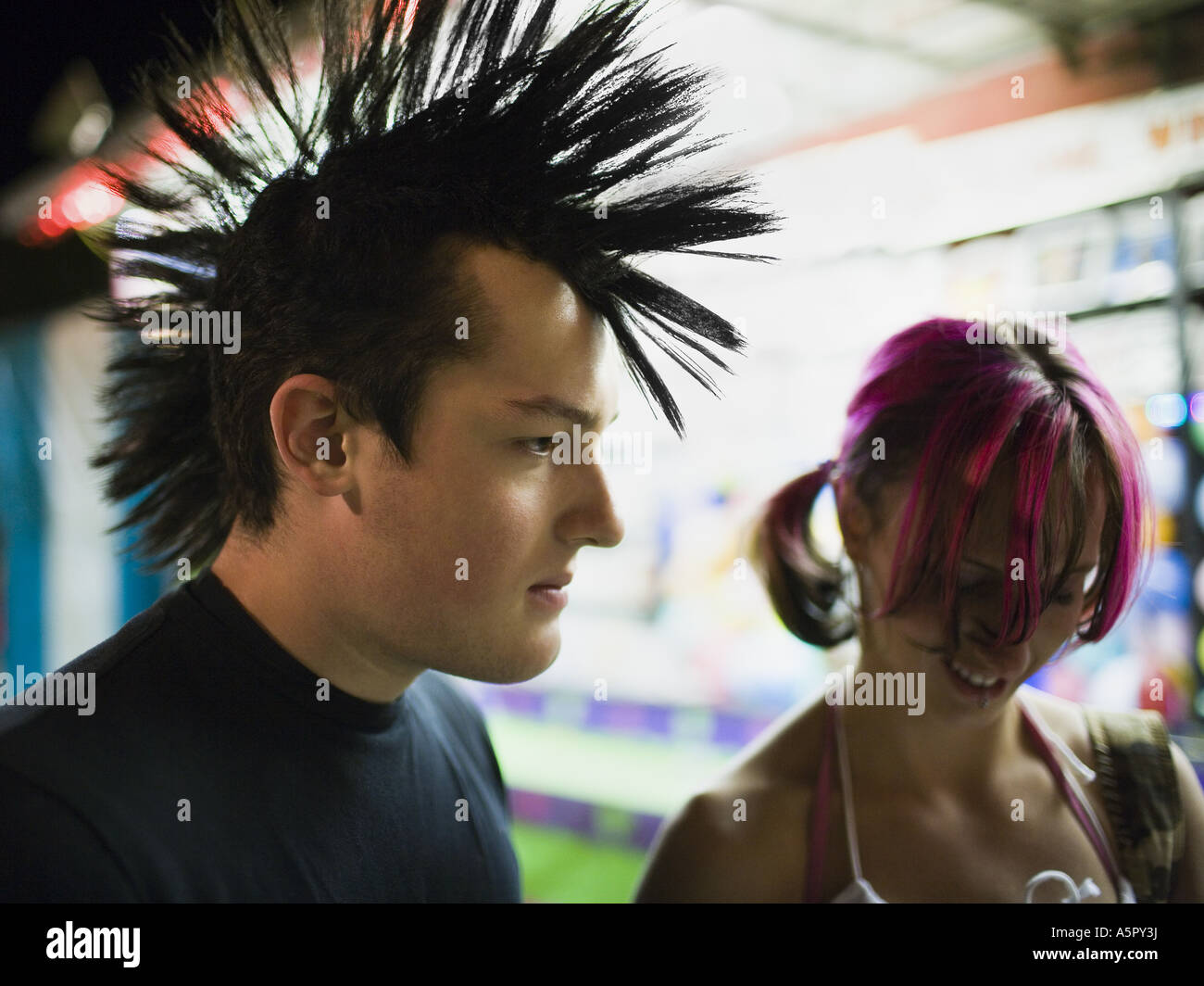 Punk couple at a fairground Stock Photo - Alamy