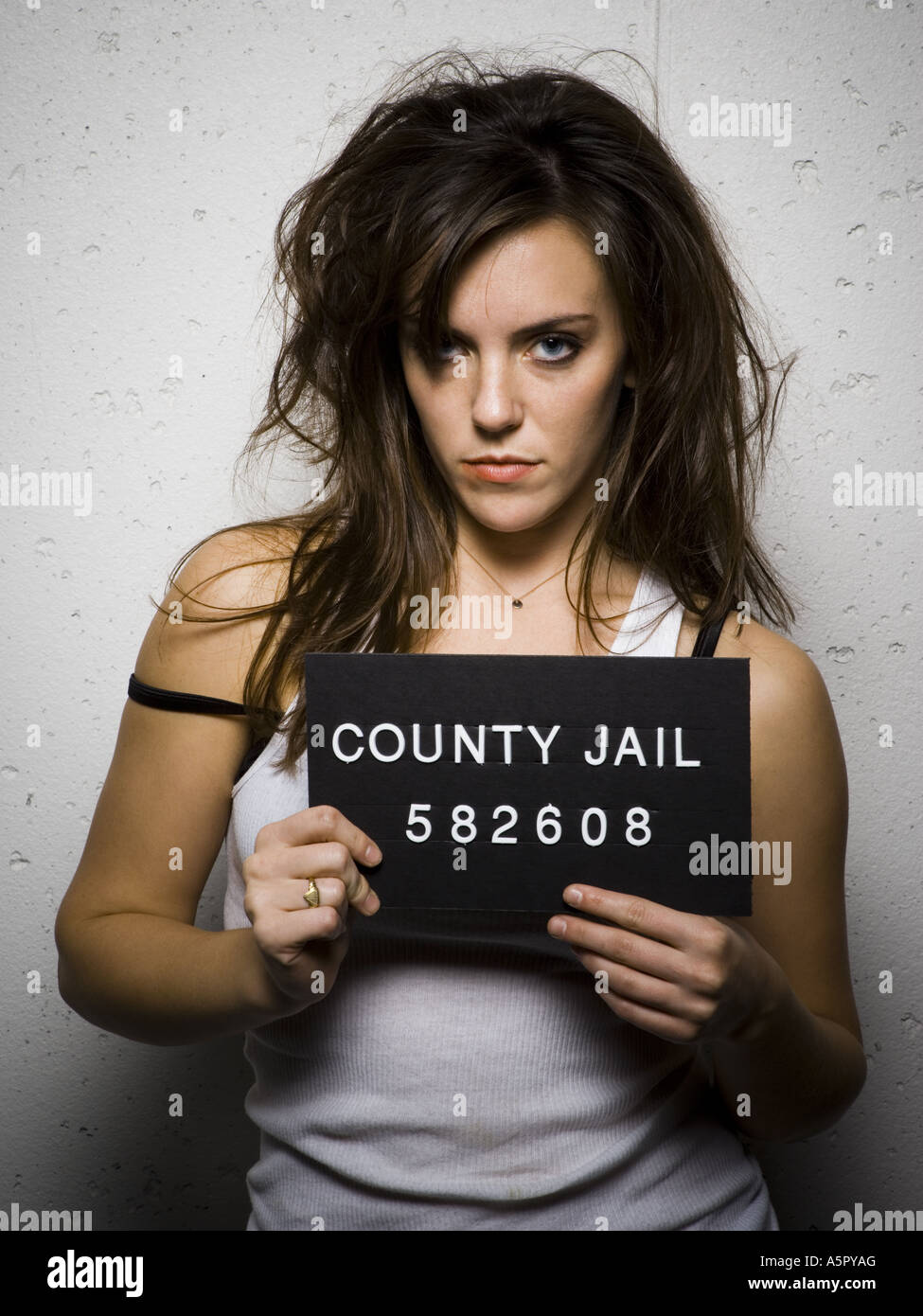 Mug shot of disheveled woman Stock Photo - Alamy