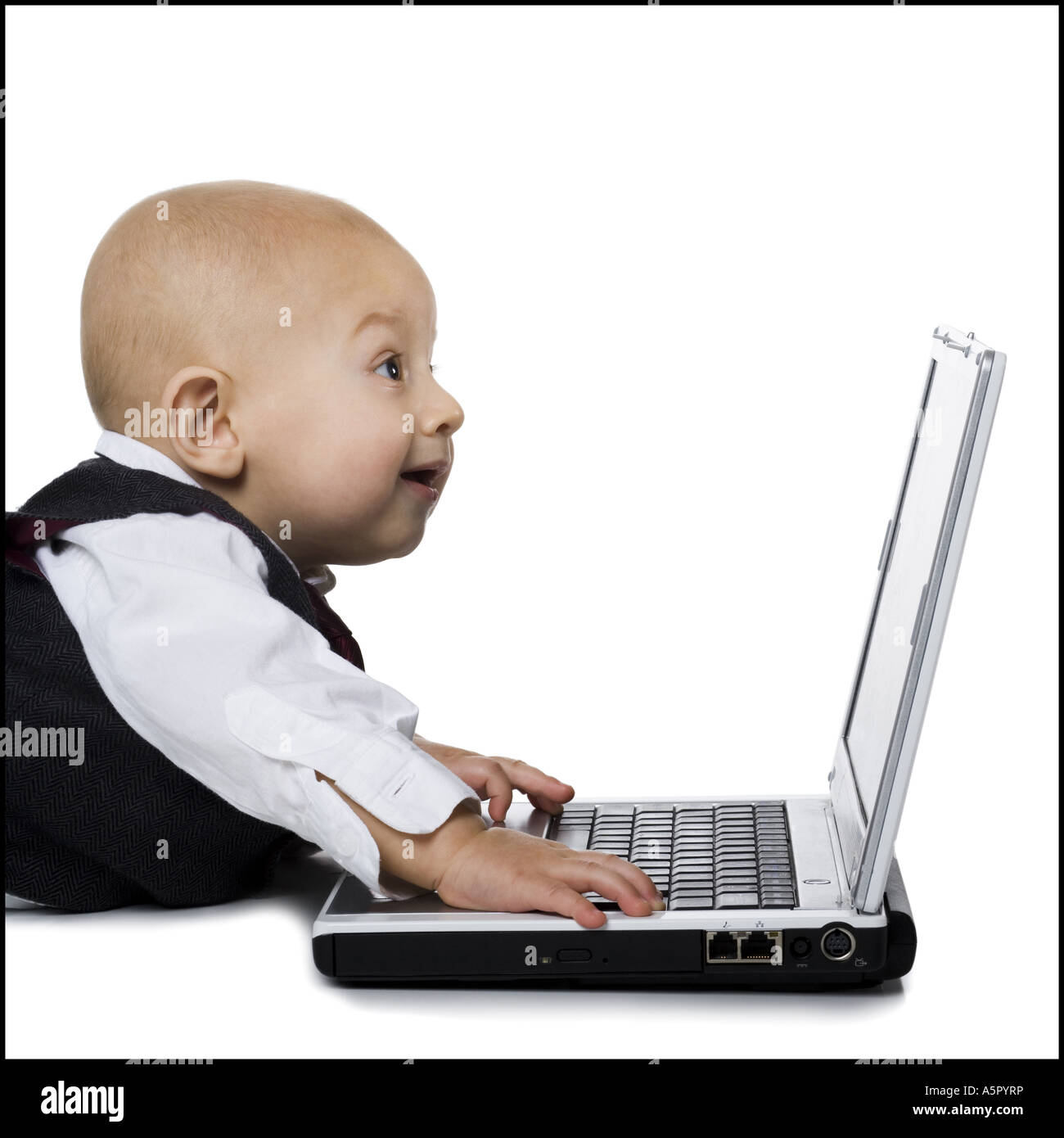 Baby boy in suit with laptop Stock Photo - Alamy