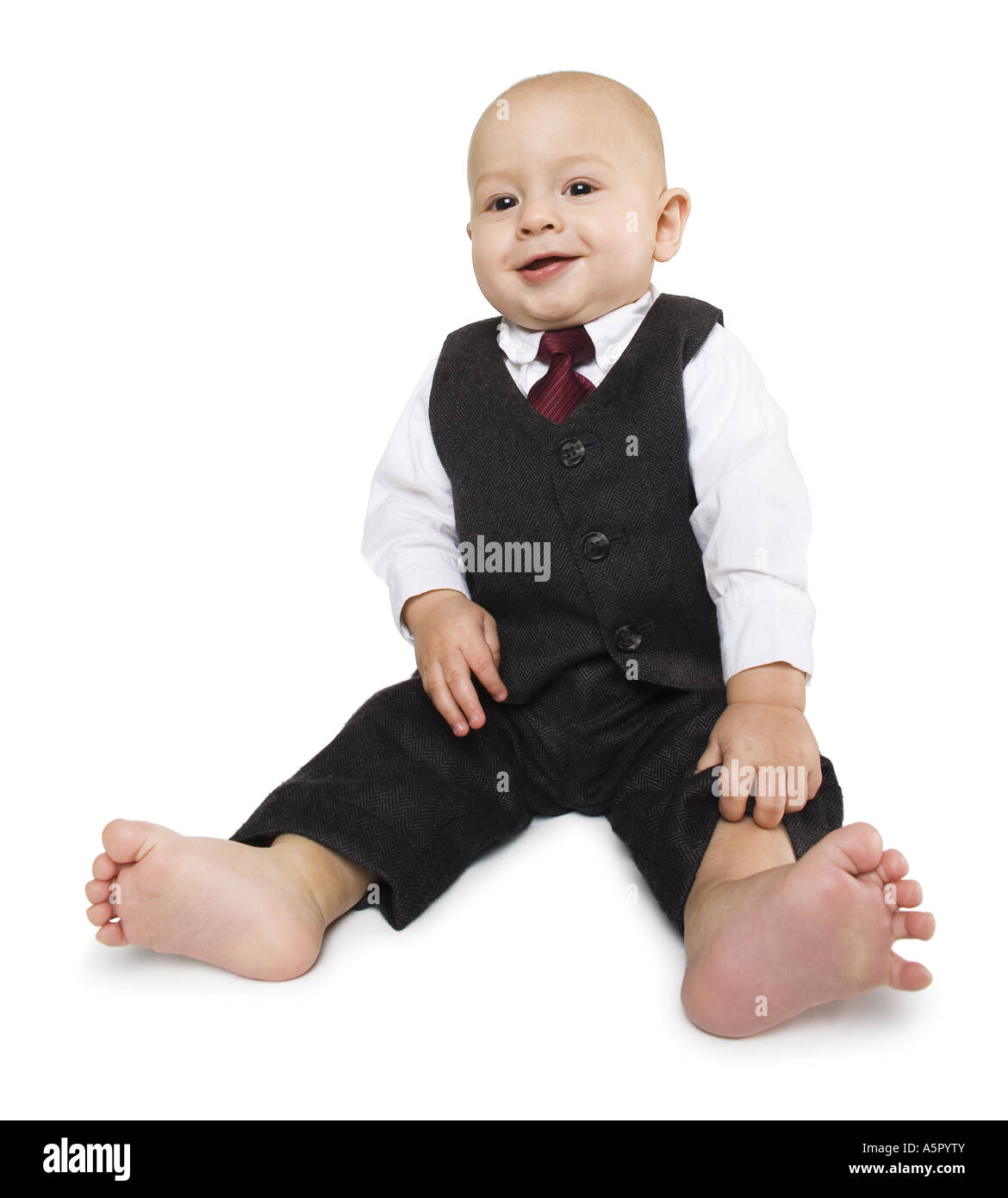 Baby boy in business suit sitting Stock Photo - Alamy