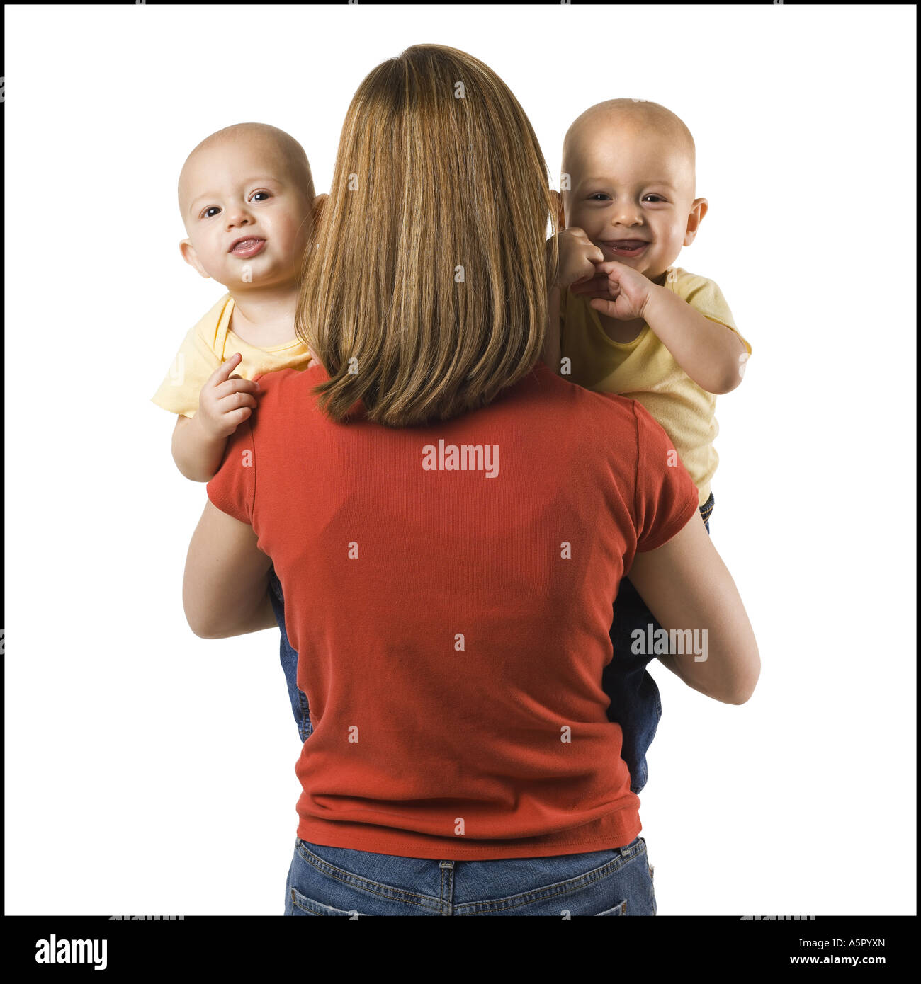 Mother with twin babies Stock Photo - Alamy