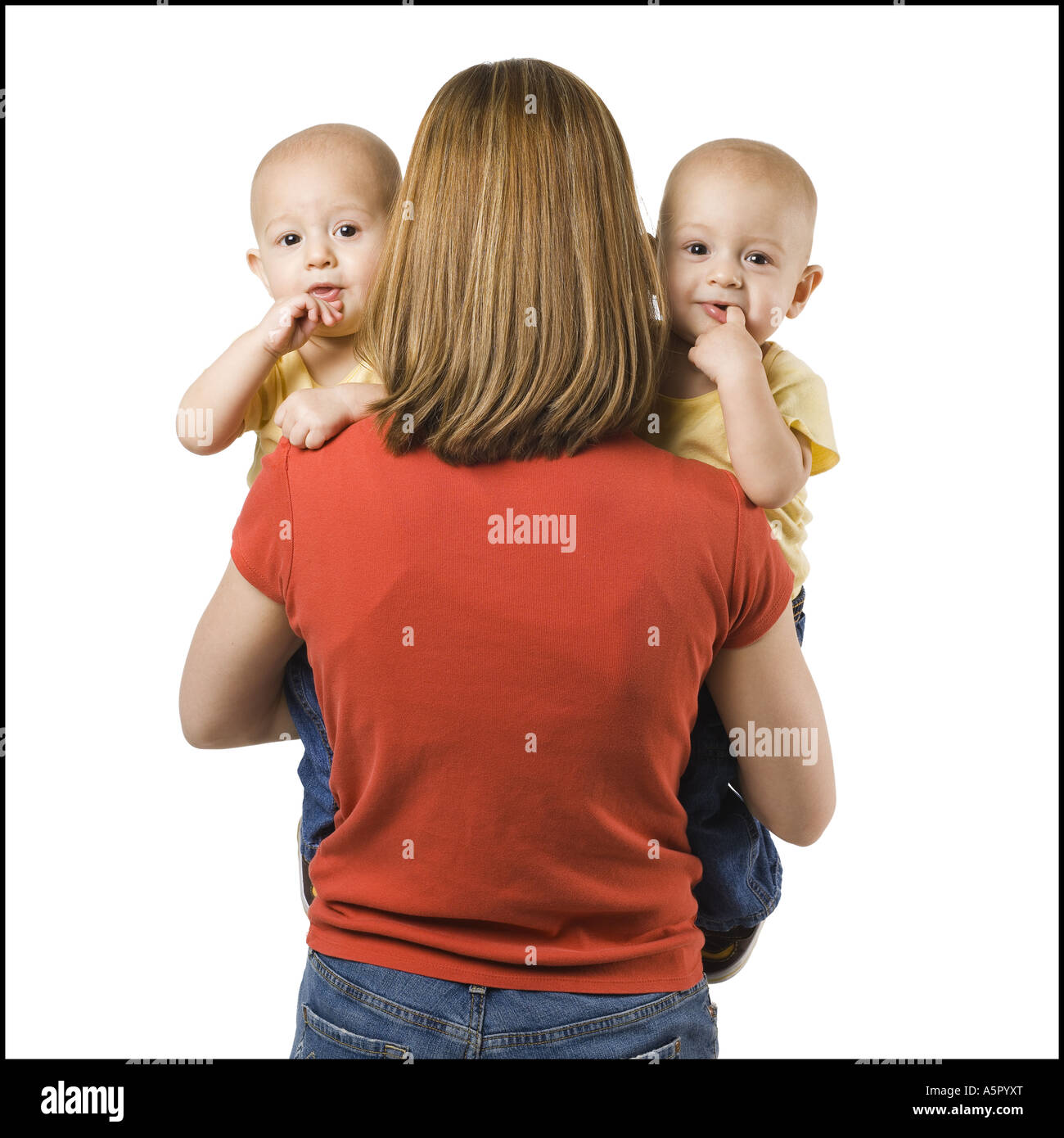 Mother with twin babies Stock Photo - Alamy
