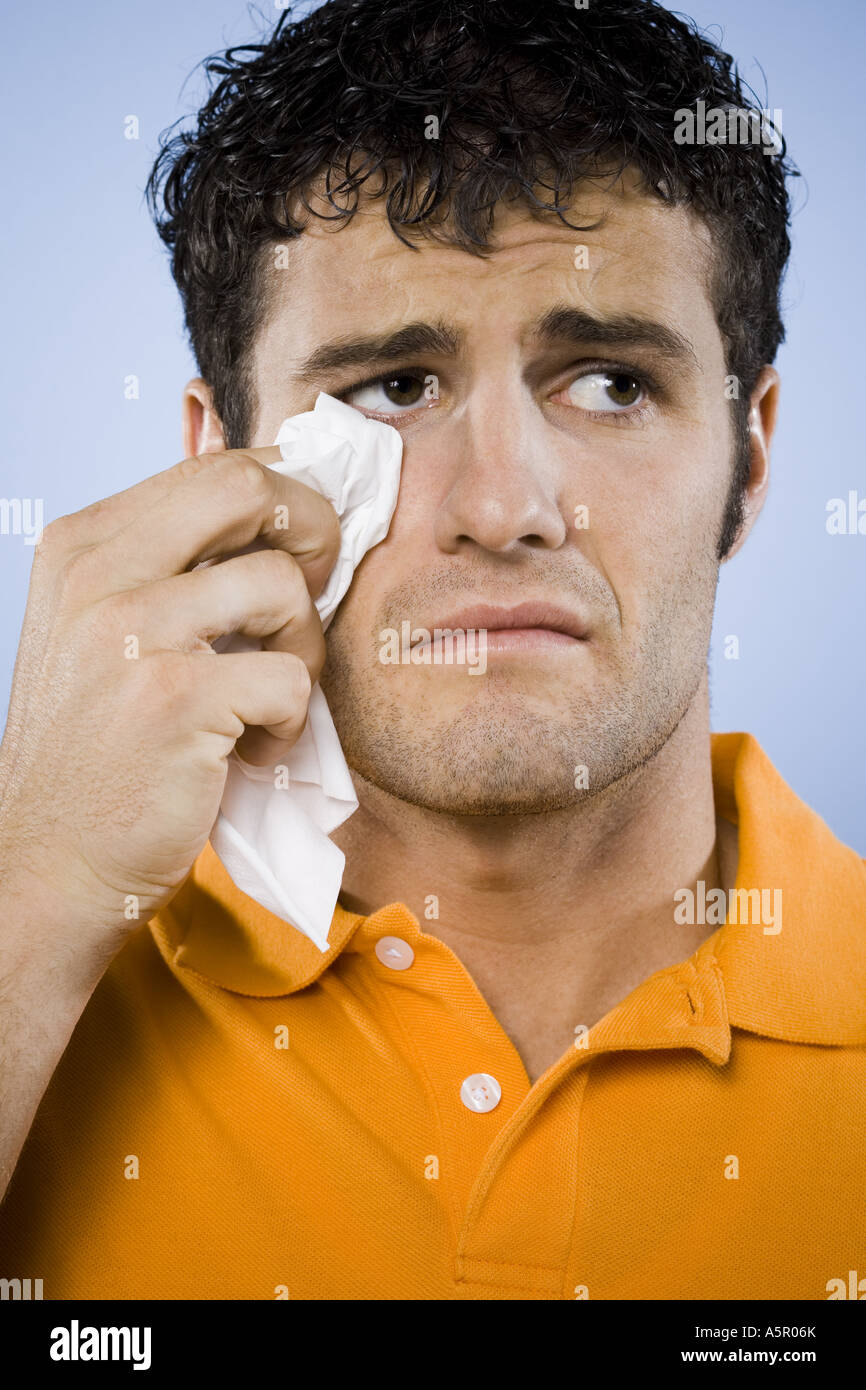 Man crying with tissue Stock Photo - Alamy