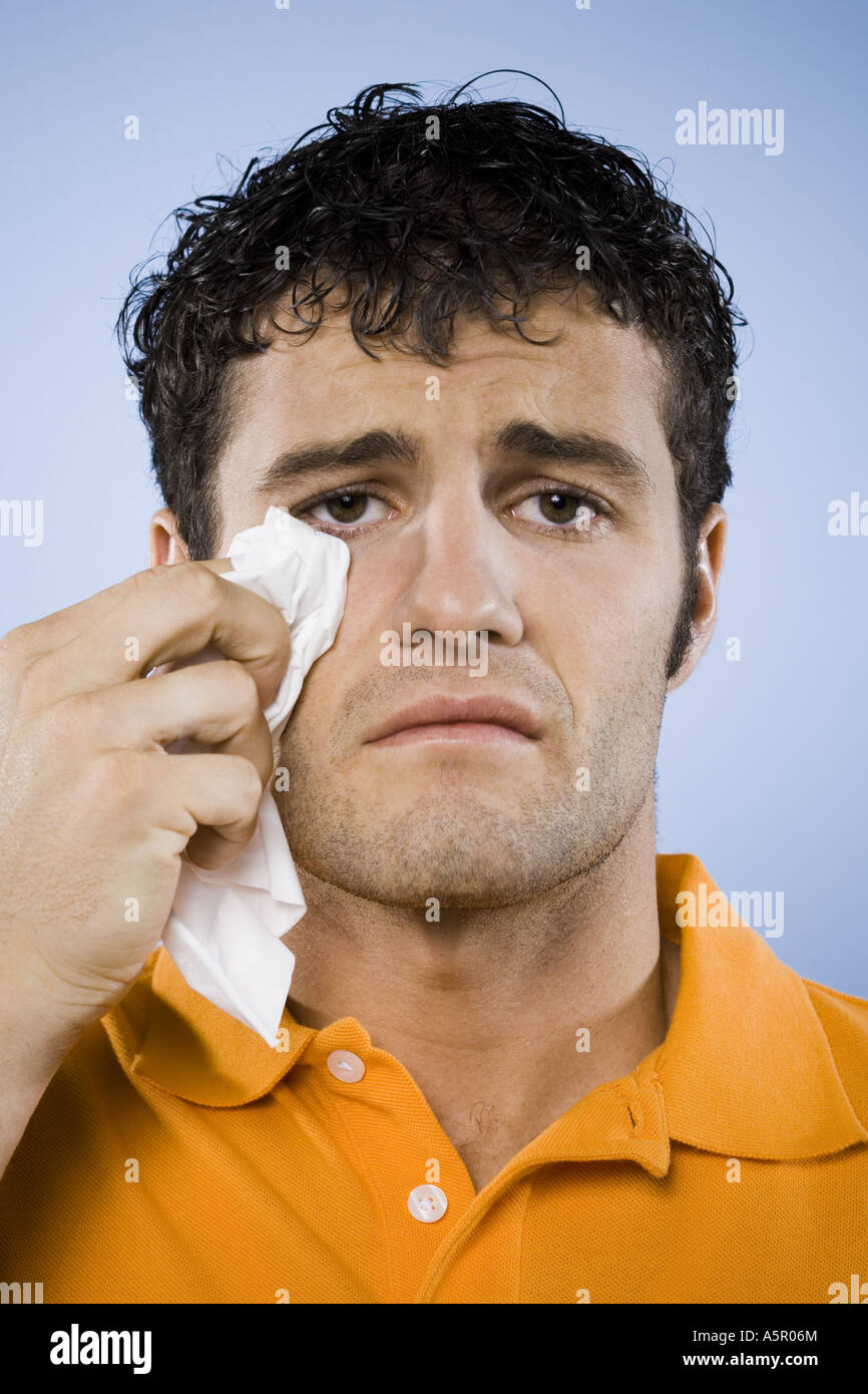 Man crying with tissue Stock Photo - Alamy