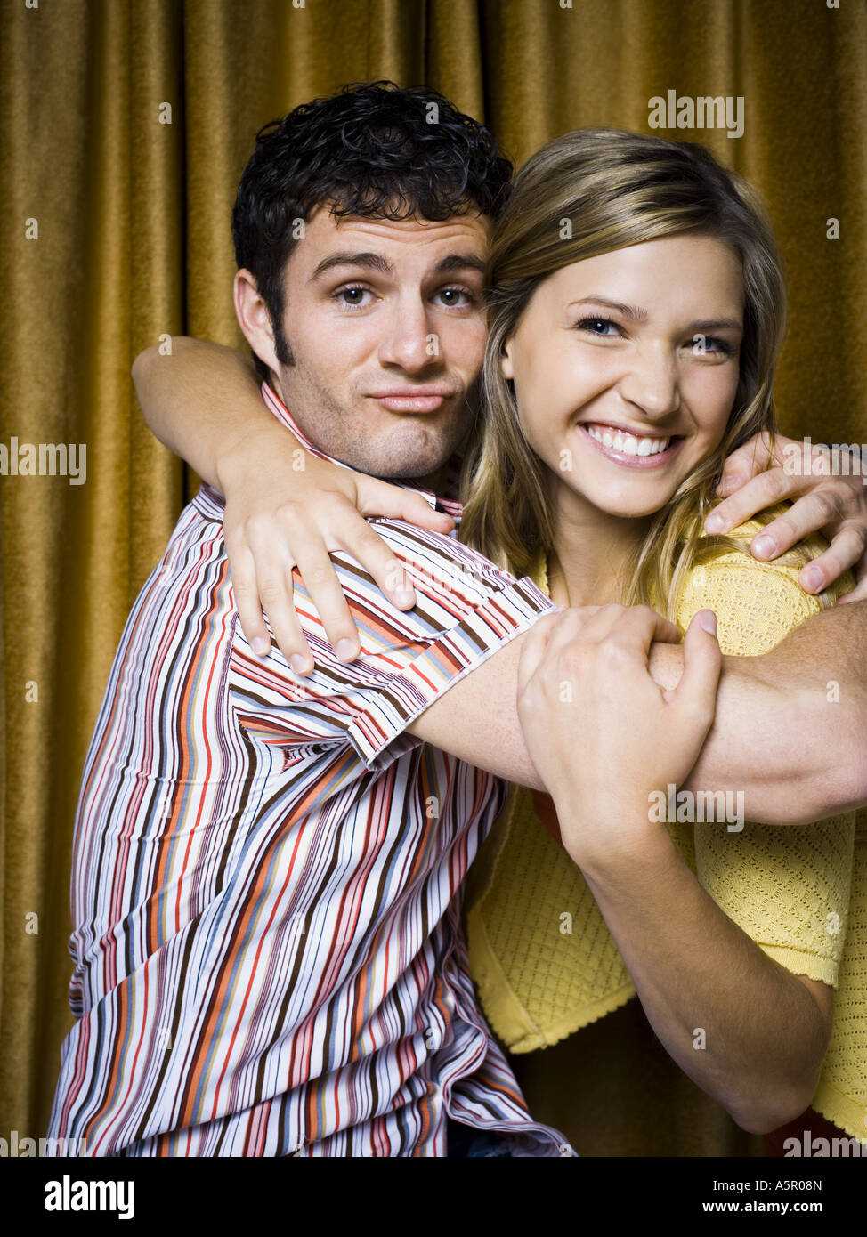 Couple in photo booth smiling Stock Photo - Alamy