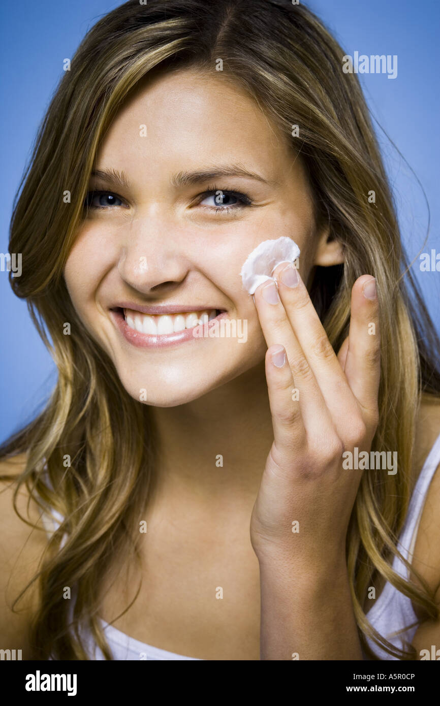 Woman with cleansing cream Stock Photo - Alamy